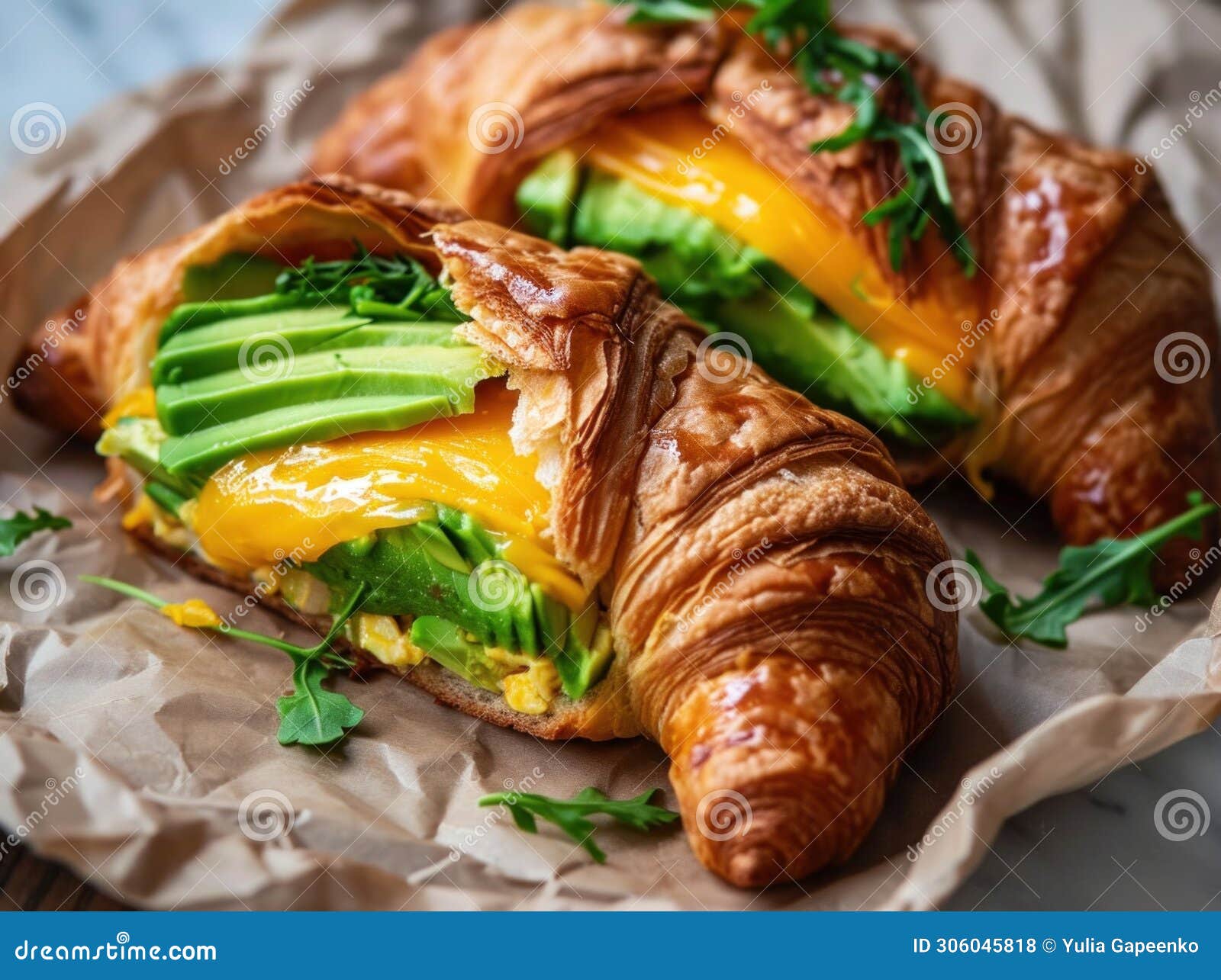 Two Croissant Sandwiches with Avocado and Cheese on Top Stock Photo ...