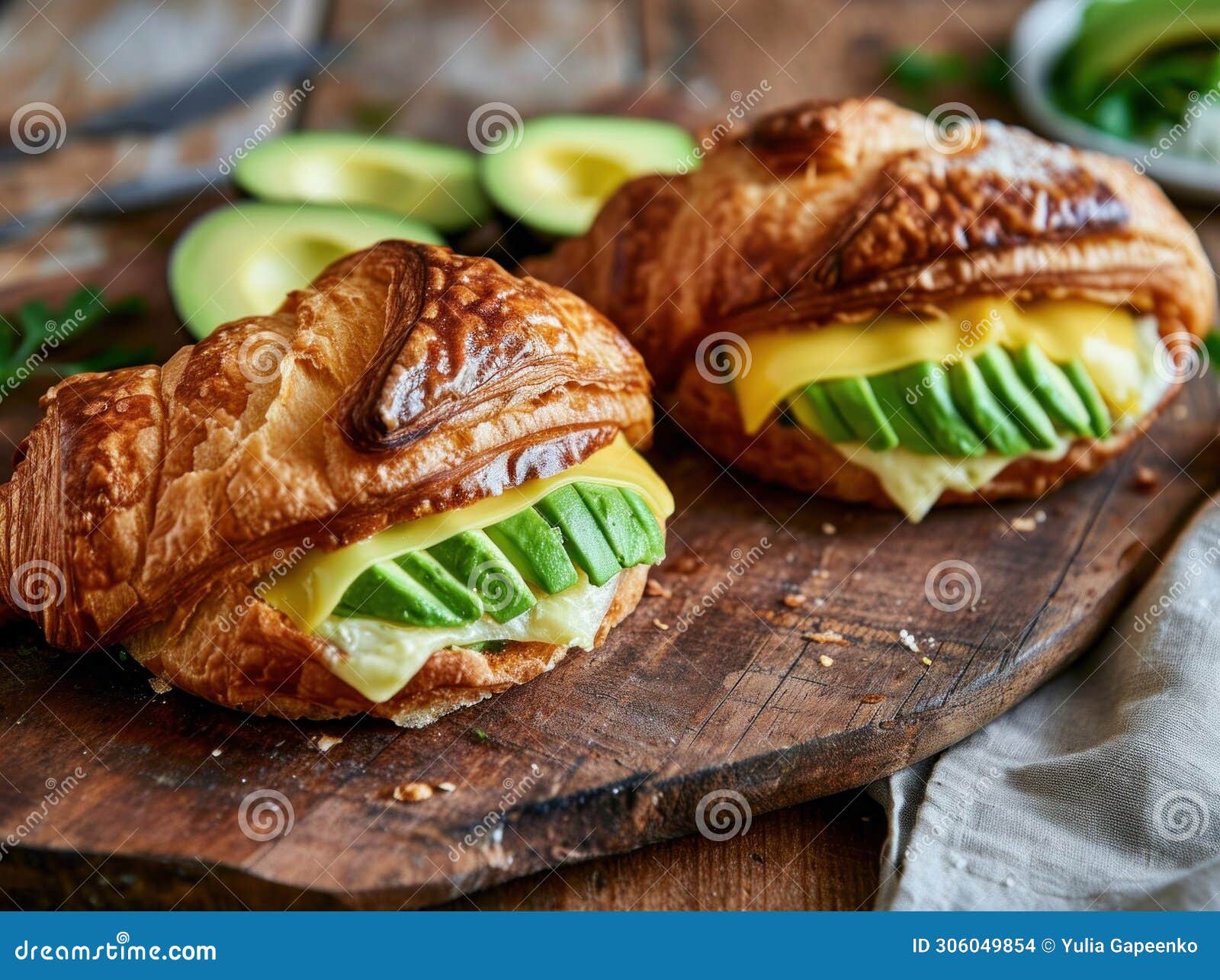 Two Croissant Sandwiches with Avocado and Cheese on Top Stock Photo ...