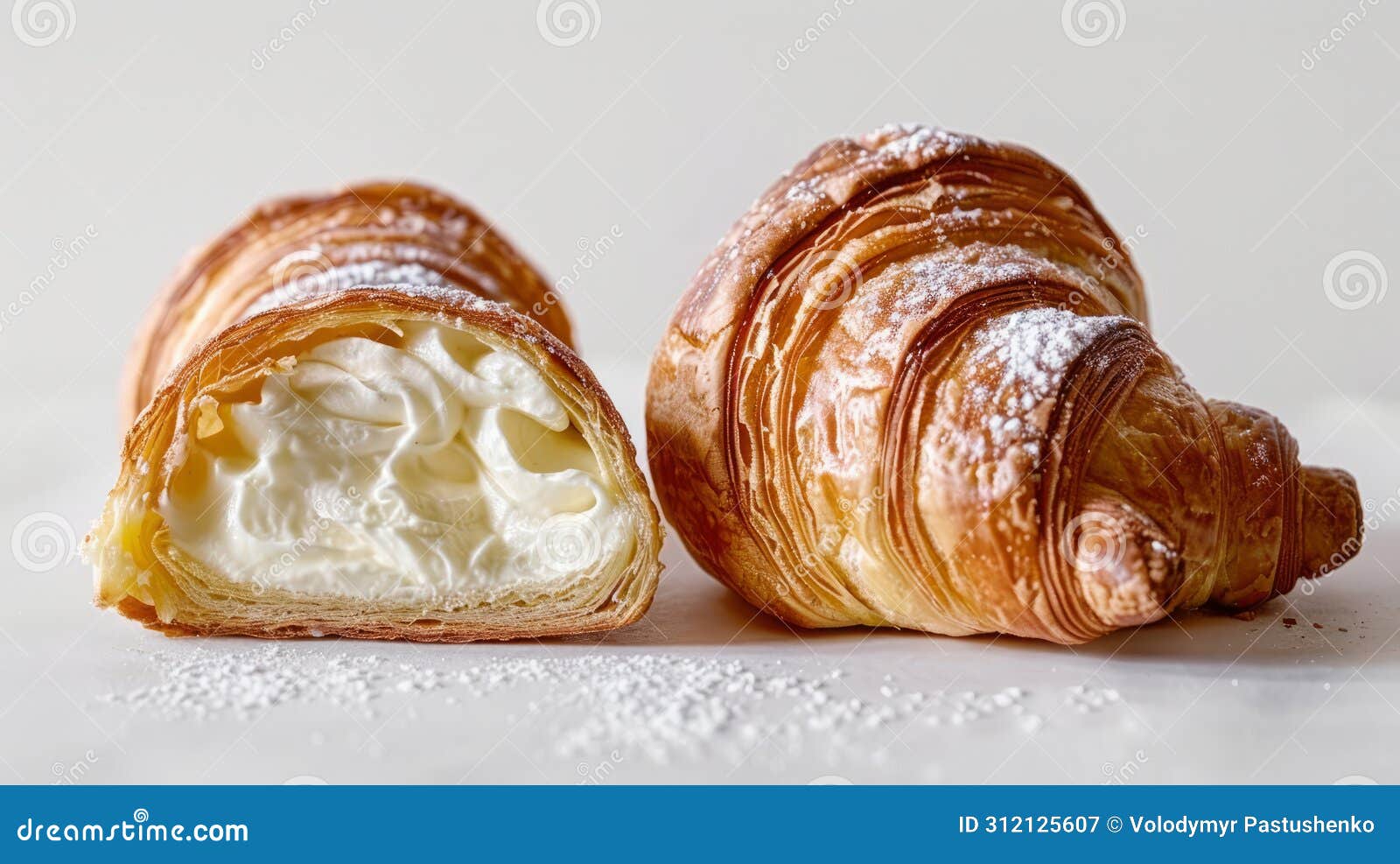 Two Croissants One Cut in Half on White Surface Stock Image - Image of ...