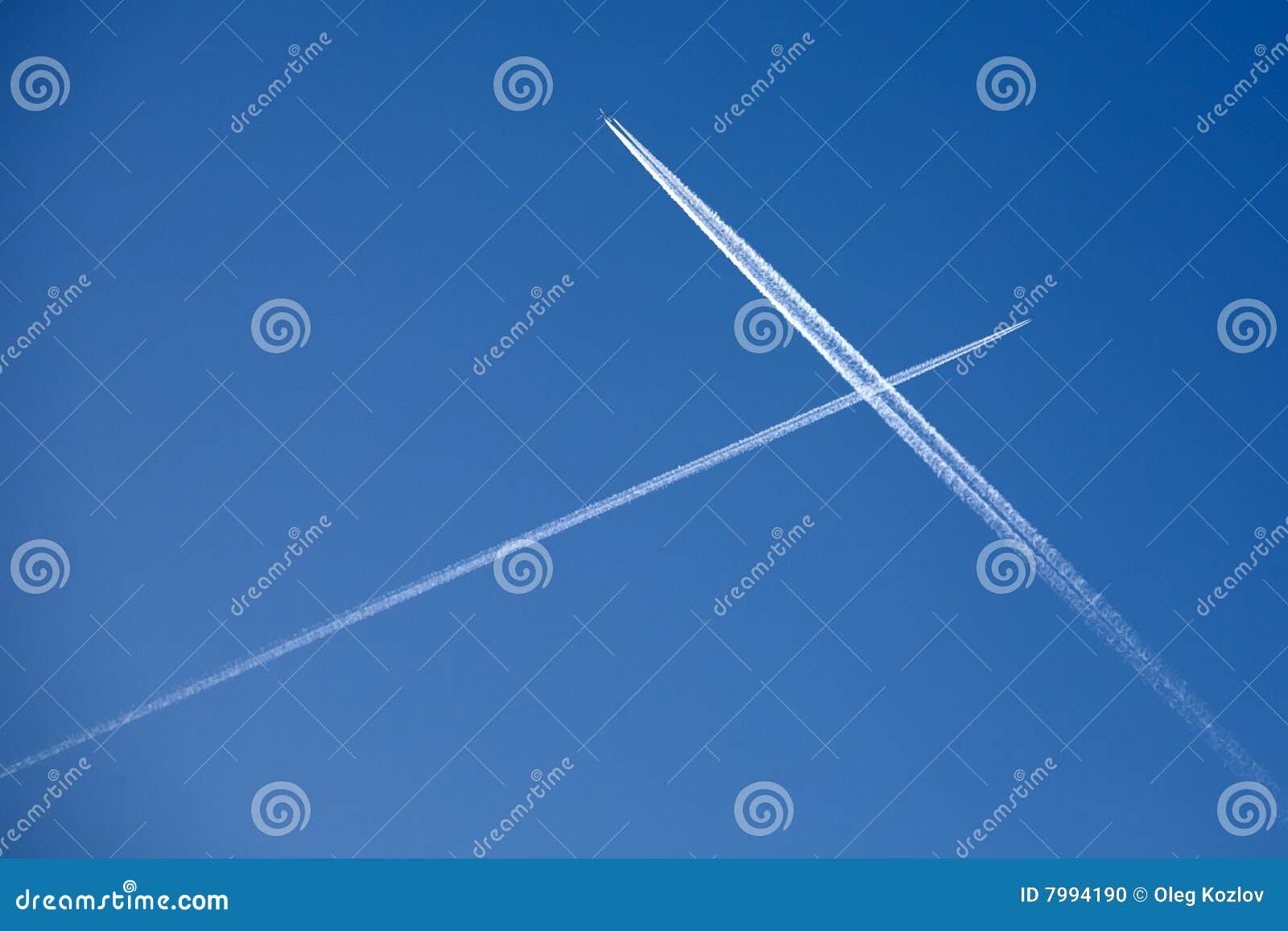Two crossing plane traces stock photo. Image of speed - 7994190
