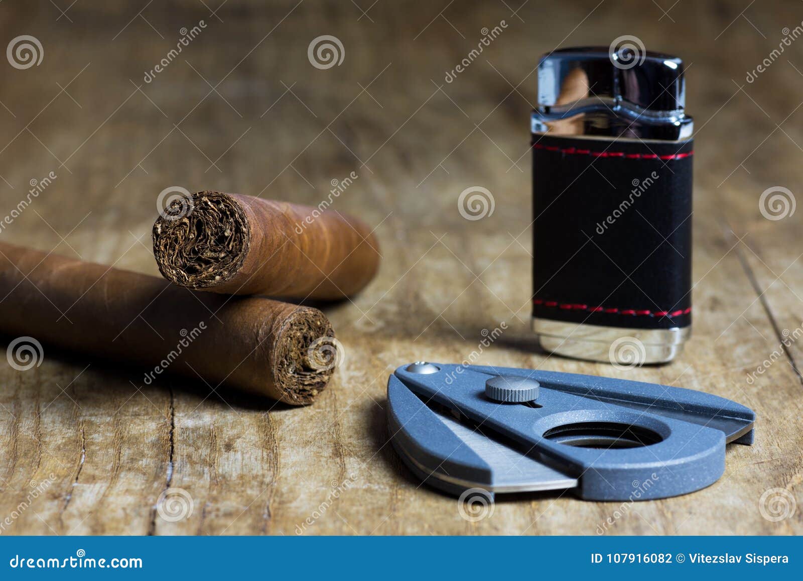 Two Cuban Cigars with a Lighter and a Cutter Stock Photo - Image of ...