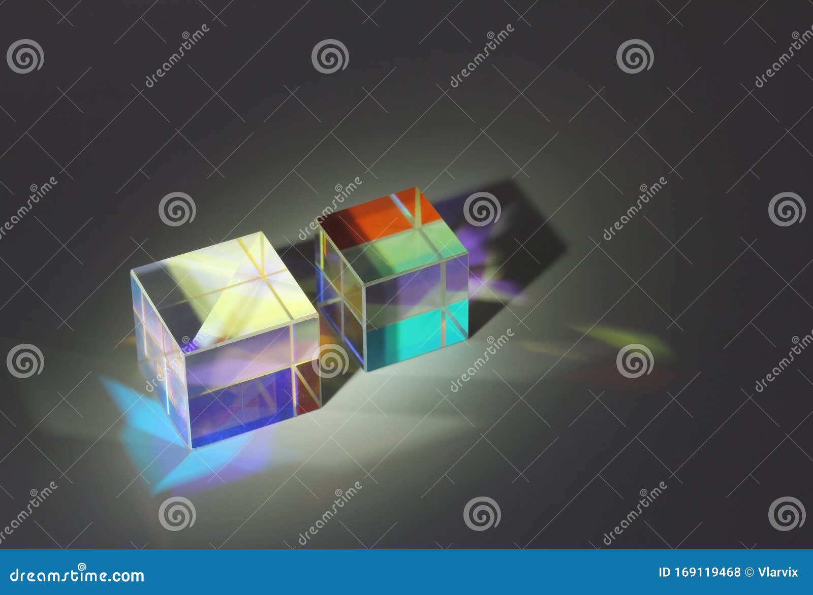 Two Cubic Glass Prism Refract Light Into Different Colors And Cast ...