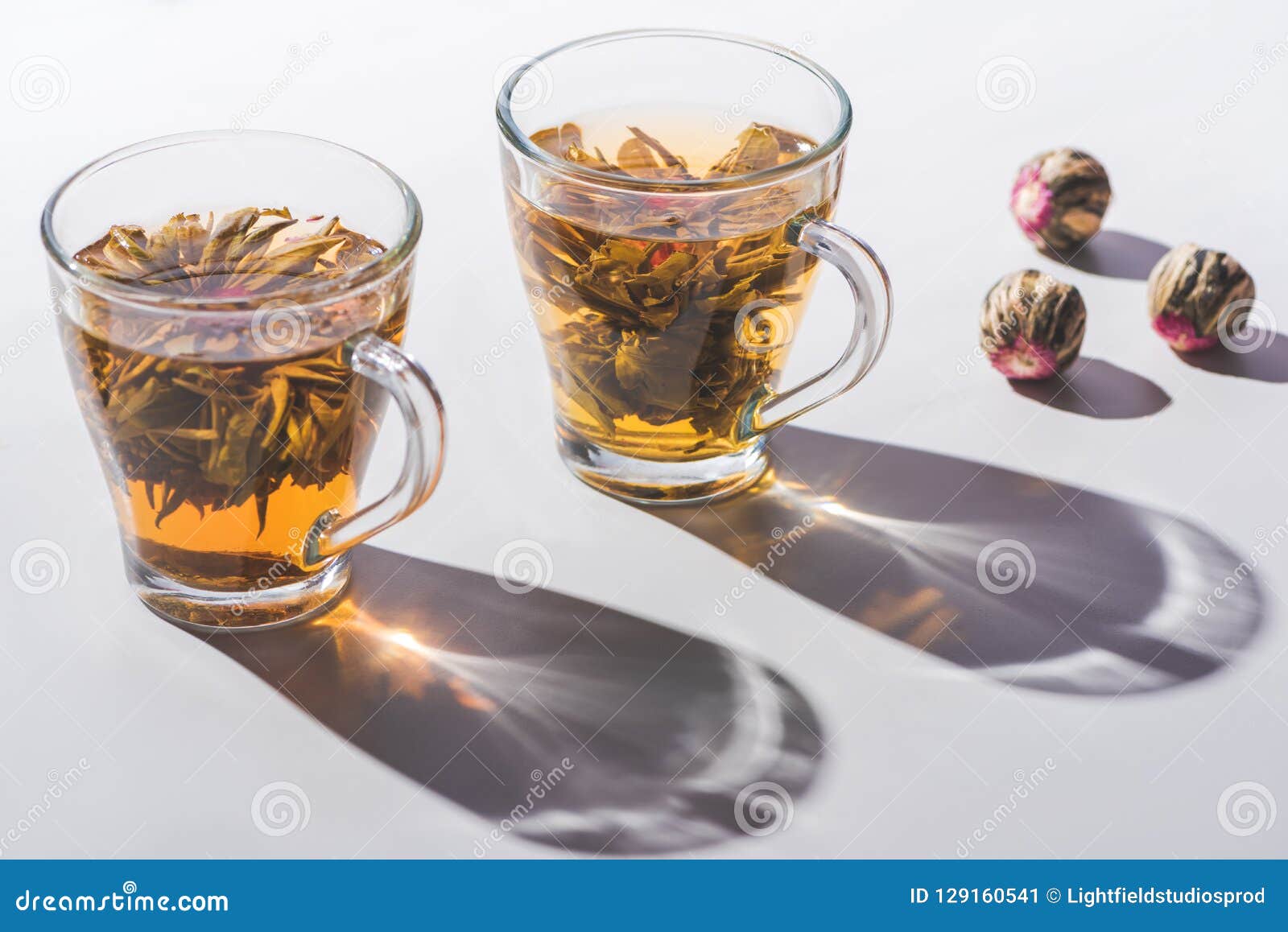 Two Cups of Chinese Flowering Tea with Tea Balls Stock Image - Image of ...