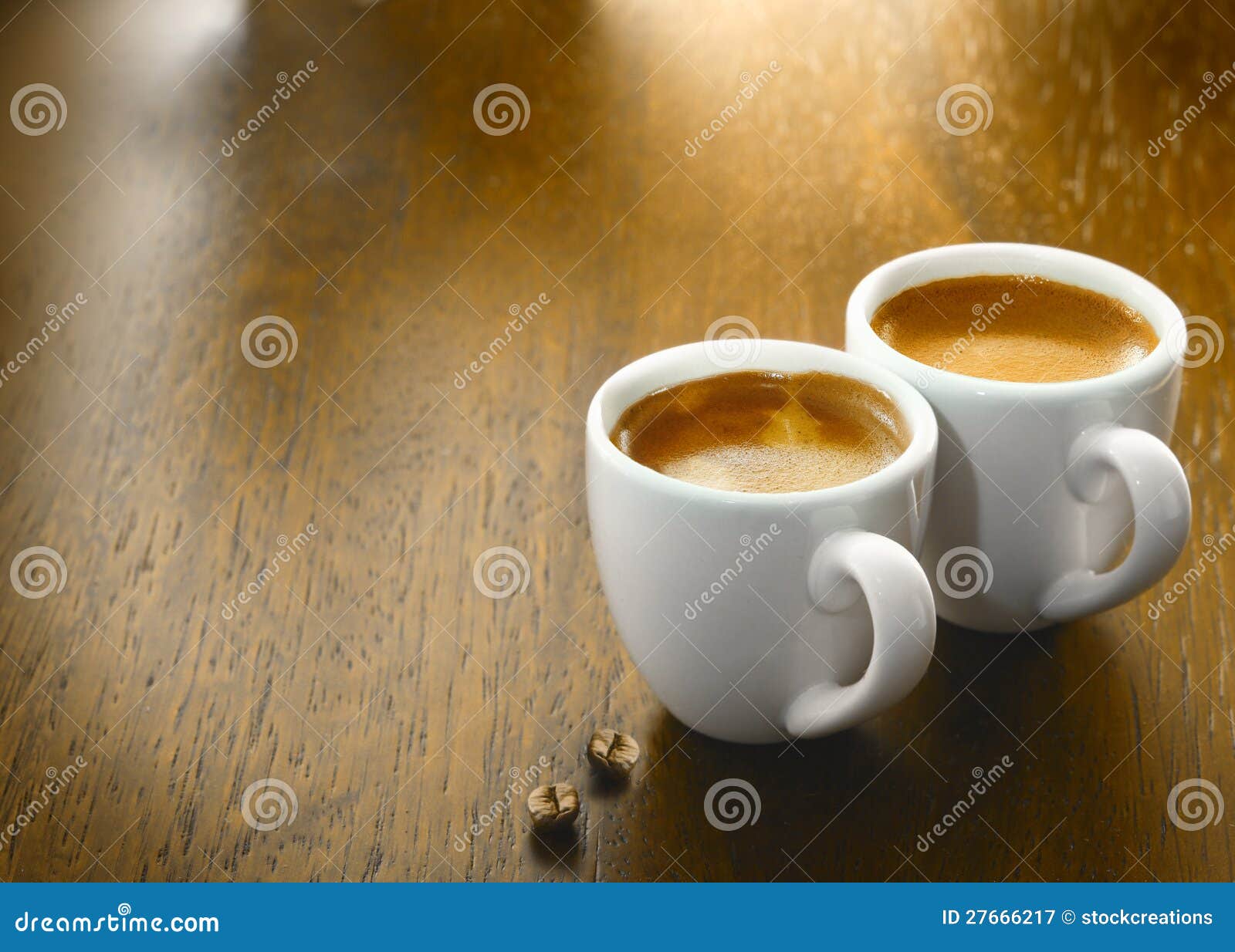 A Cup Of Brewed Pure Coffee On A Pile Of Coffee Beans On A White ...