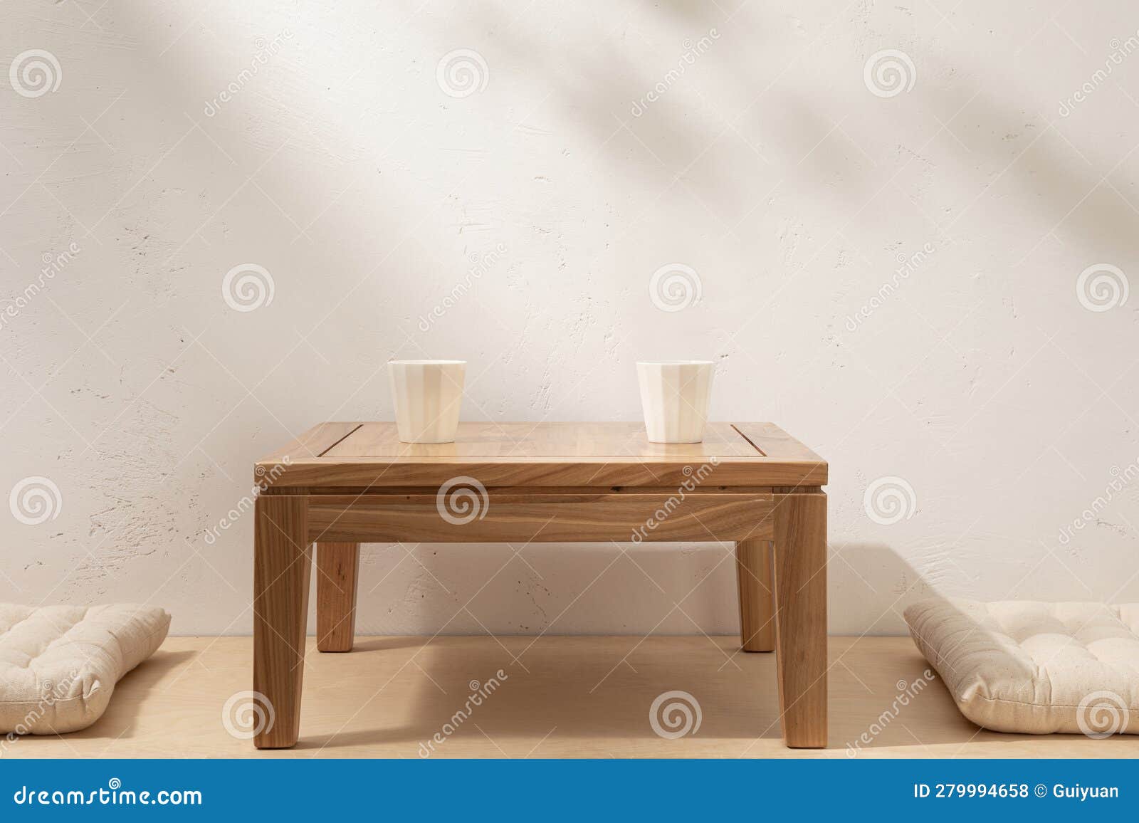 Two Cups are on the Square Table Under the Sunlight and Tree Shadow ...