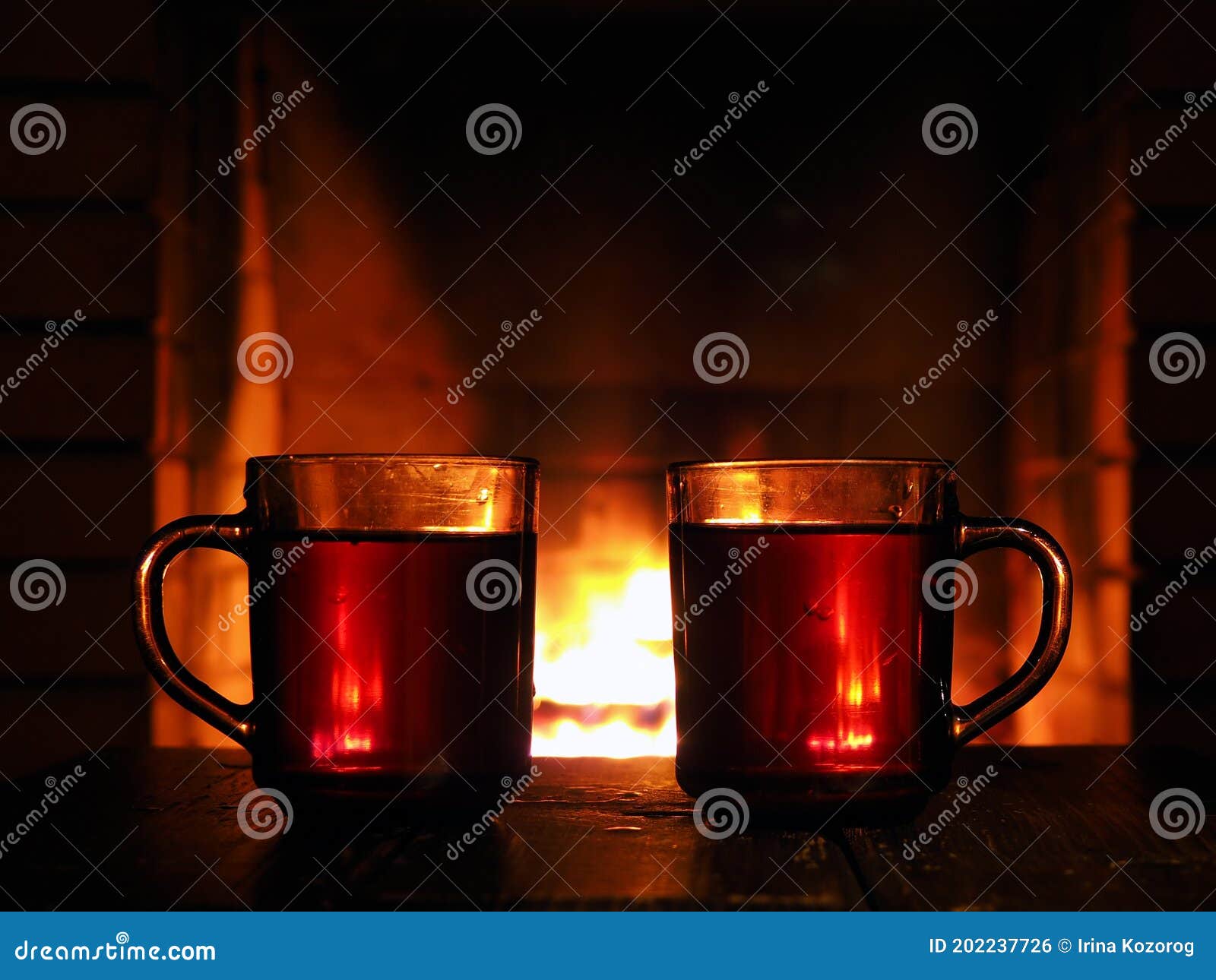 Two Cups of Tea on a Background of a Burning Fireplace. Stock Photo ...