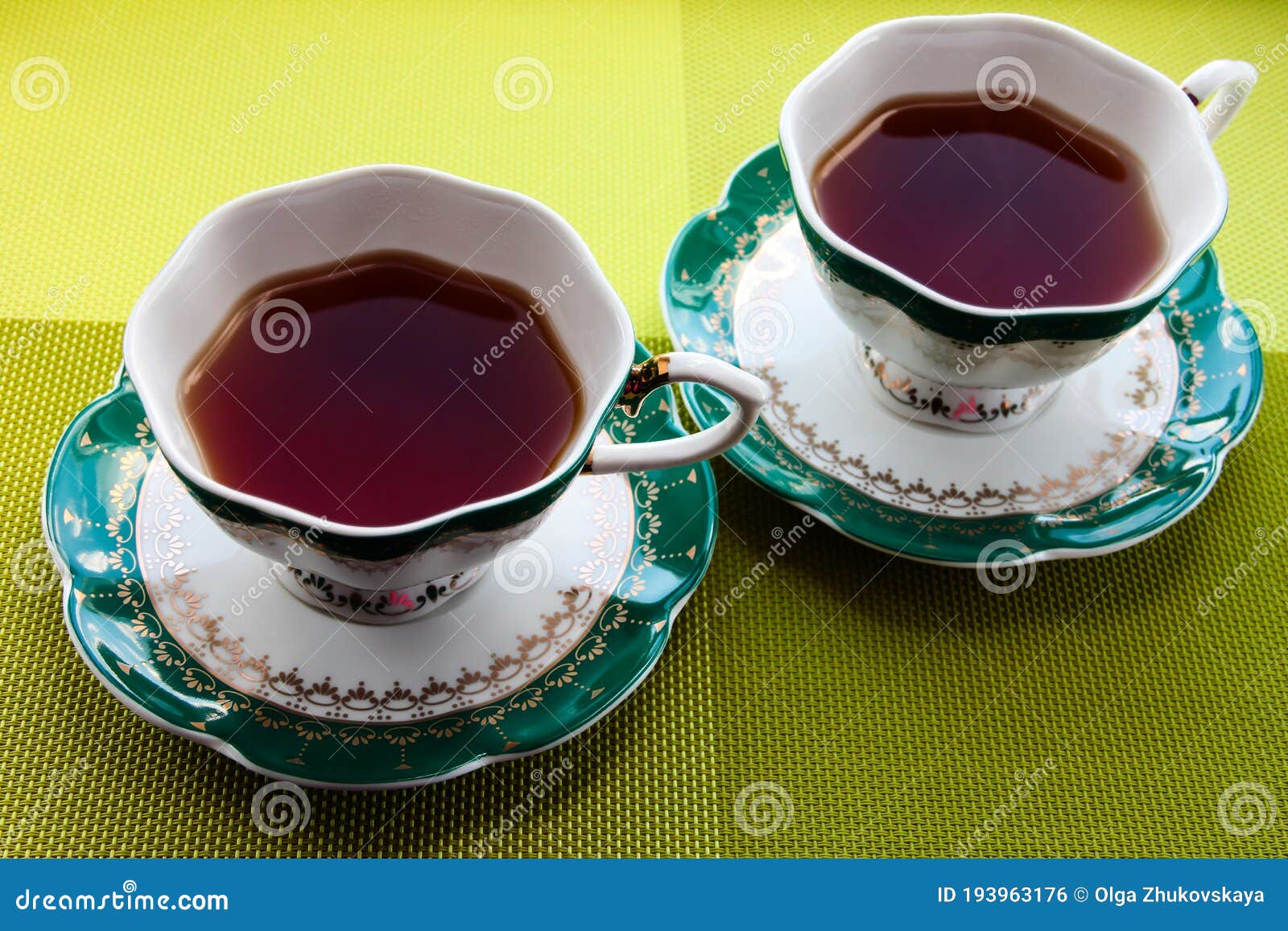 Two Cups of Tea on a Bright Green Background Stock Photo - Image of ...