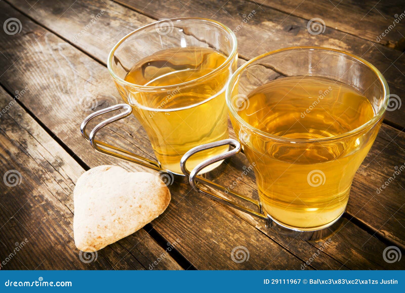 Two Cups of Tea a Plank of Wood Next To a Heart-shaped Cake. Stock ...