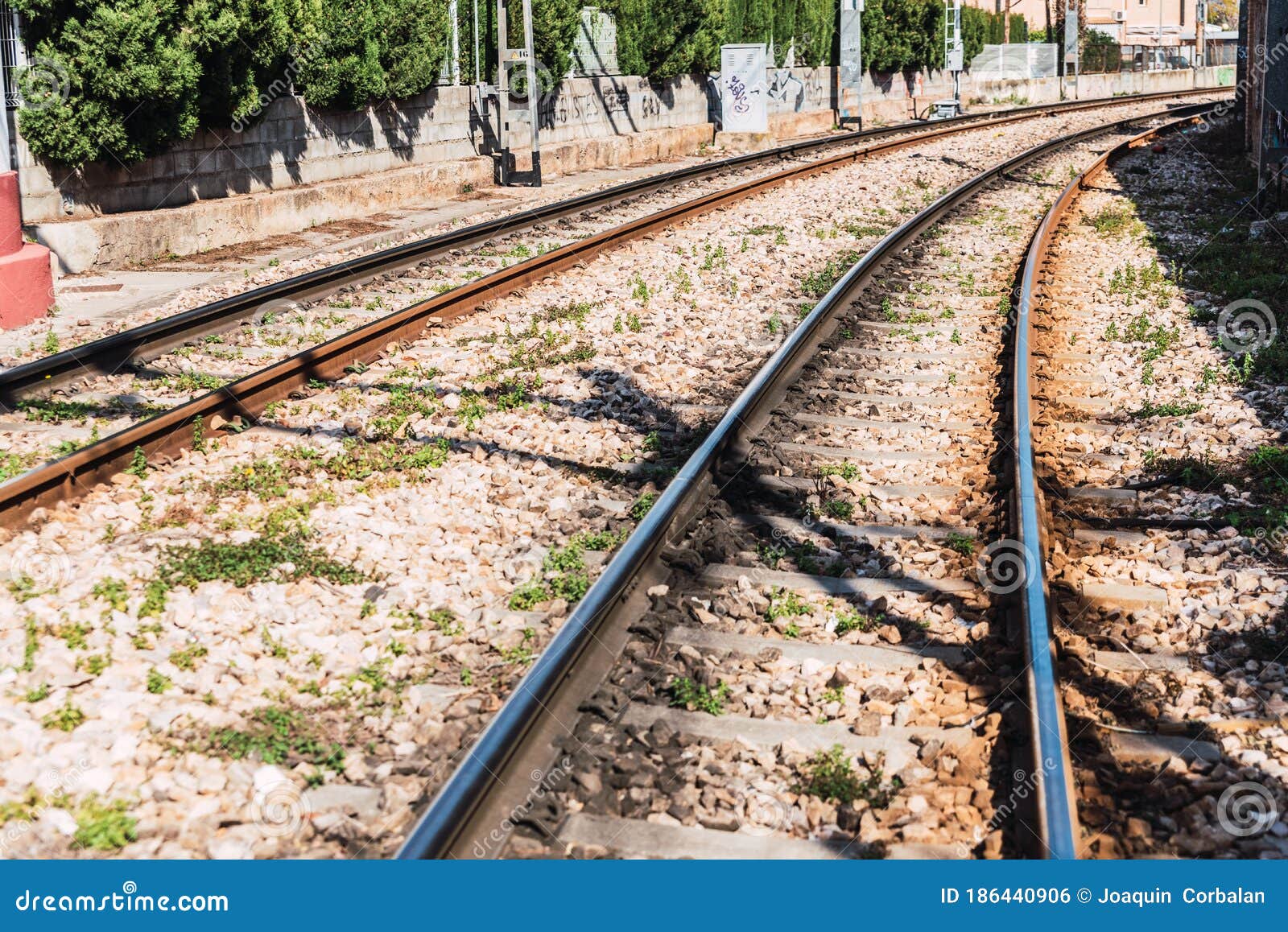Two Curved Train Tracks in a Turn within a Village Stock Photo - Image ...