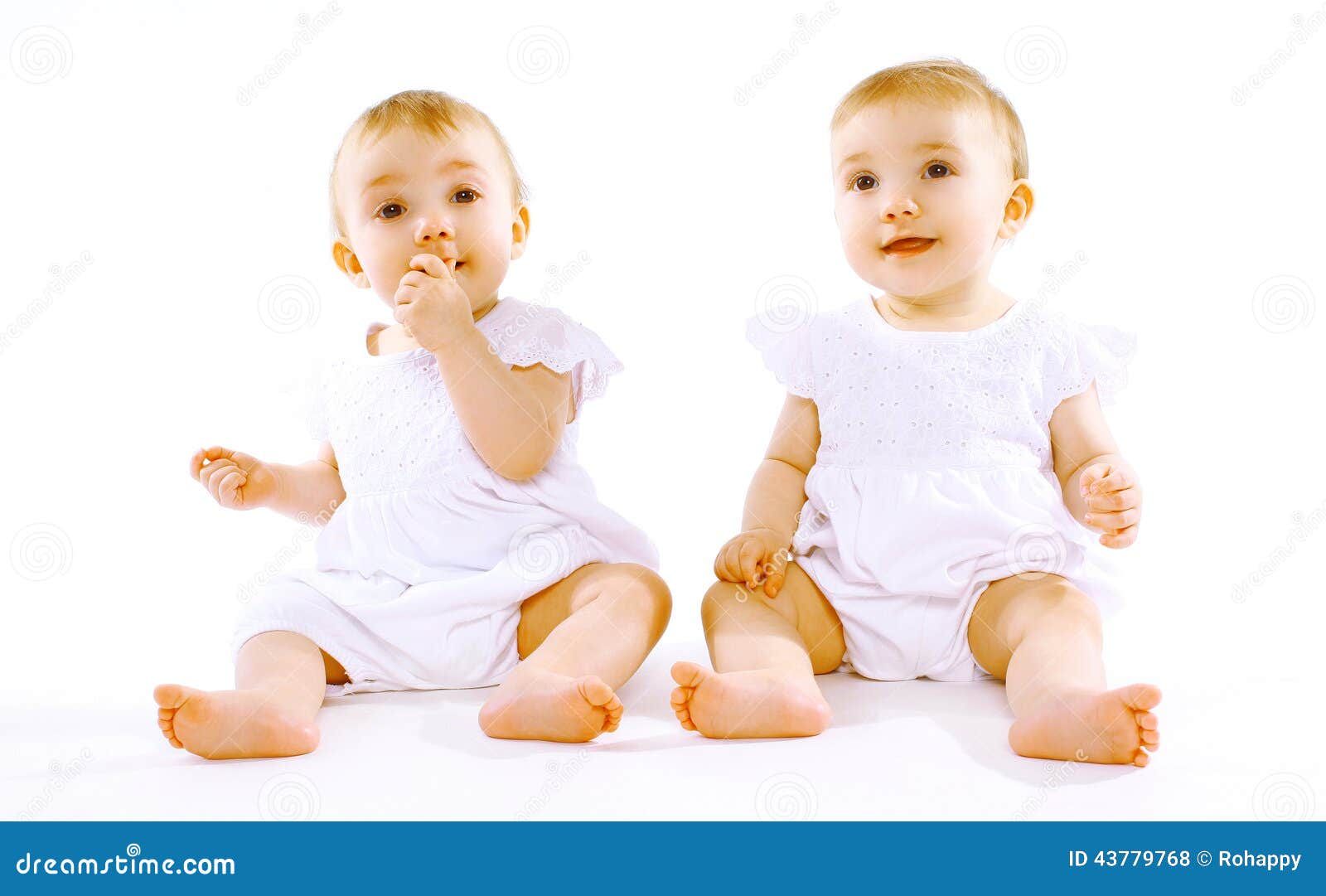 Two cute baby twins stock photo. Image of infants, expression - 43779768