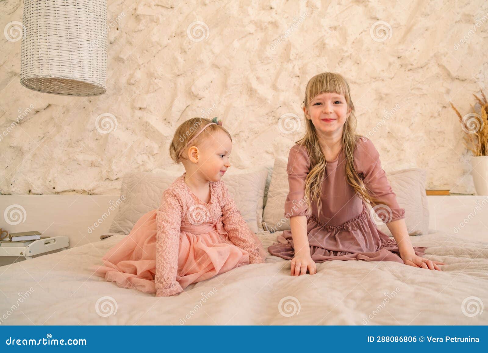 Two cute sisters portrait stock photo. Image of hands - 288086806