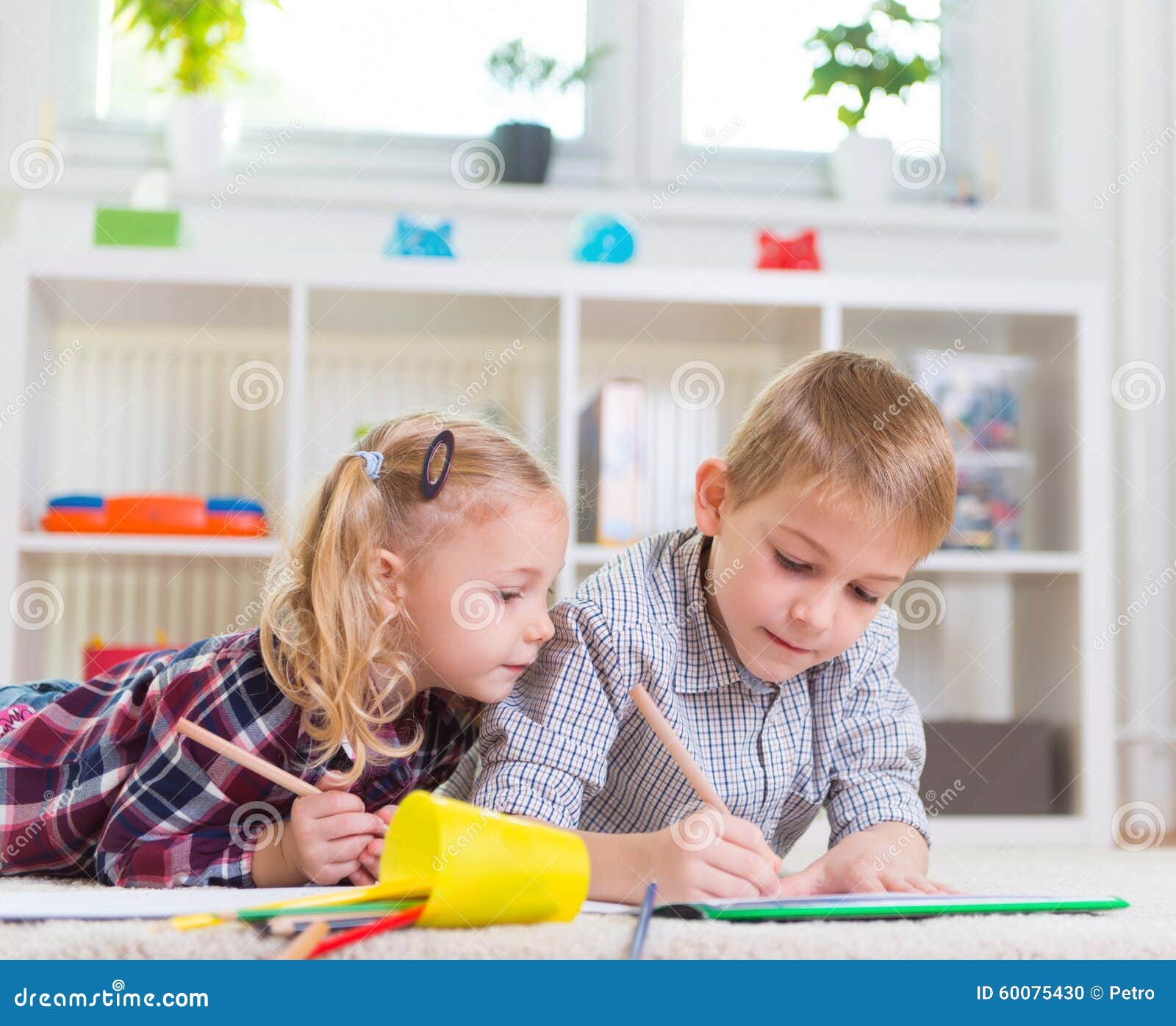 Two cute children at home stock photo. Image of clever - 60075430