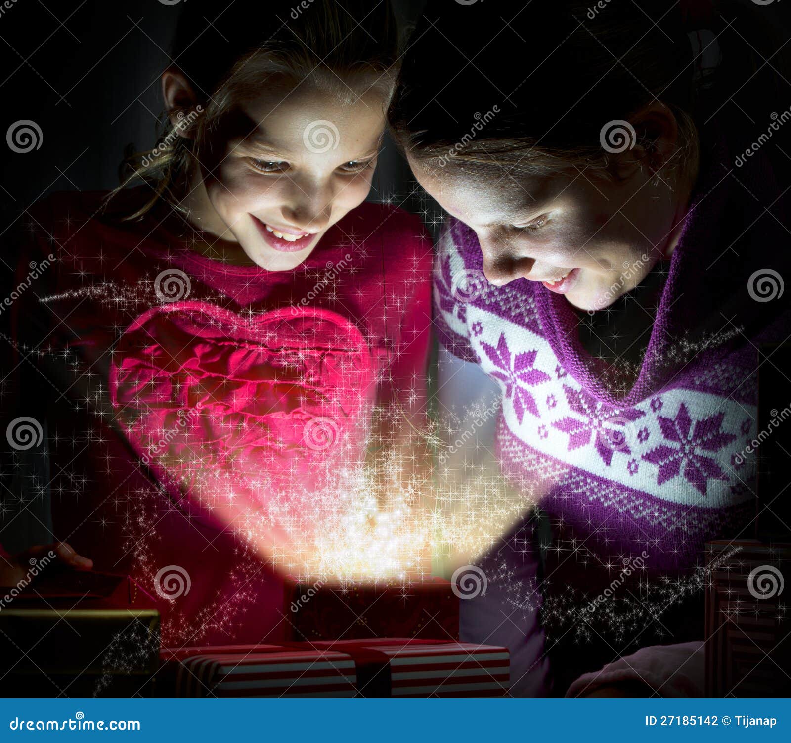 Two Cute Girls Looking Inside of a Magical Present Stock Photo - Image ...