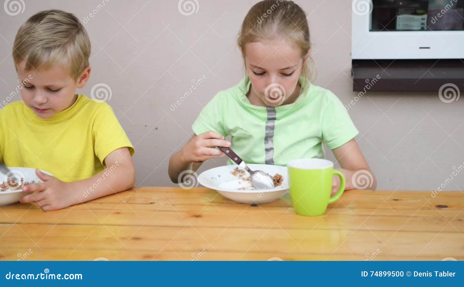 Two cute kid eating stock footage. Video of little, portrait - 74899500