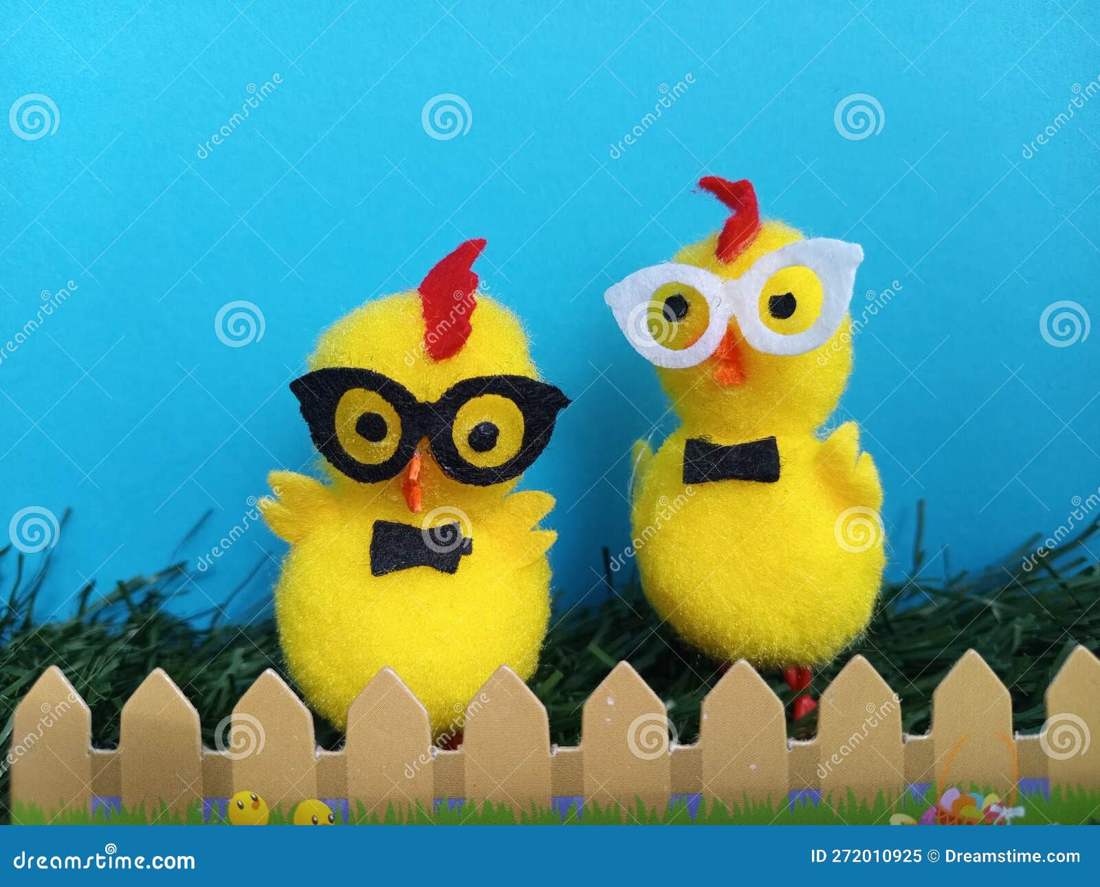 Two Cute Little Easter Chicks Wearing Glasses on Grass Behind a Fence ...