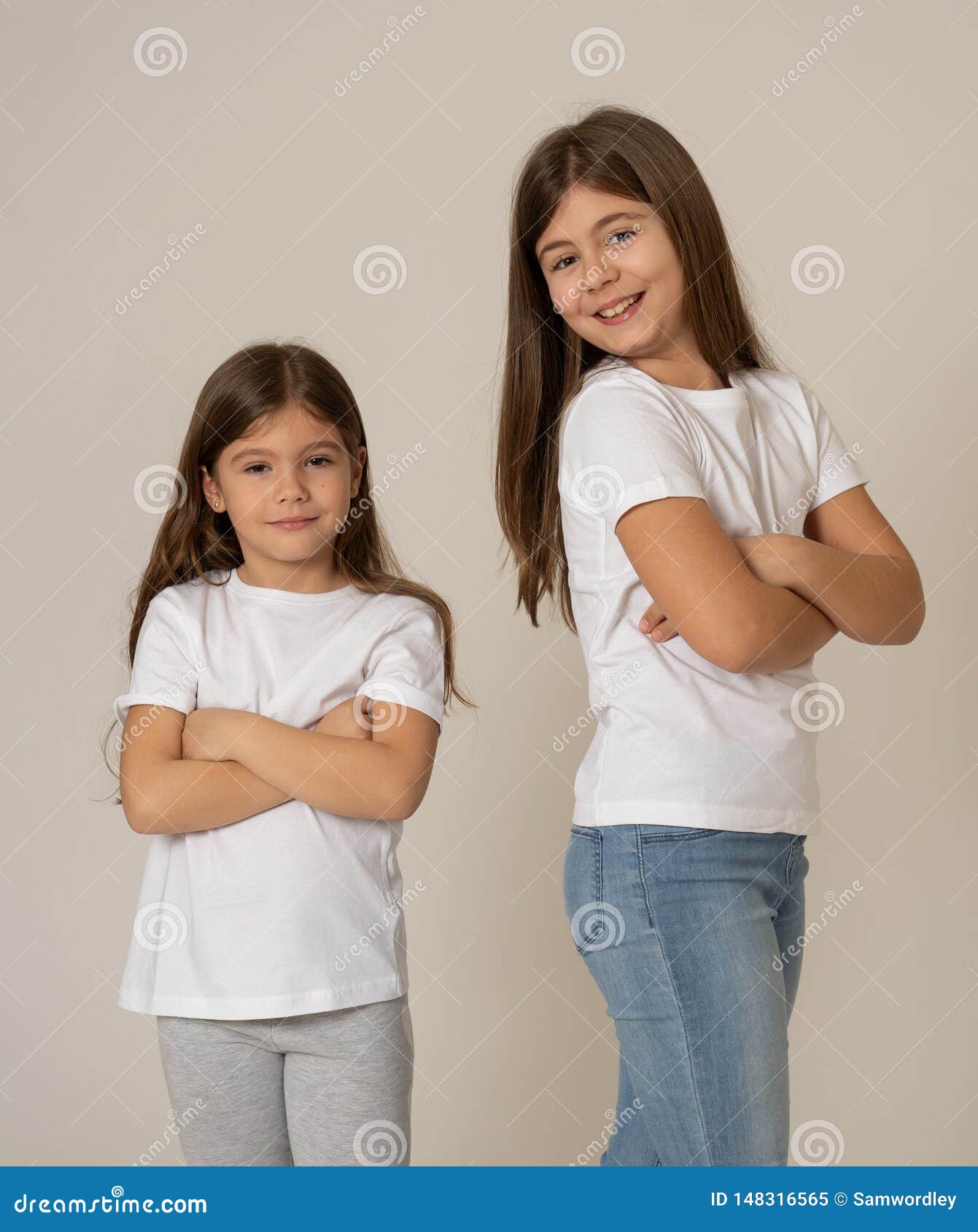 Two Cute Sisters Playing Together Having Fun Posing And Modeling Stock