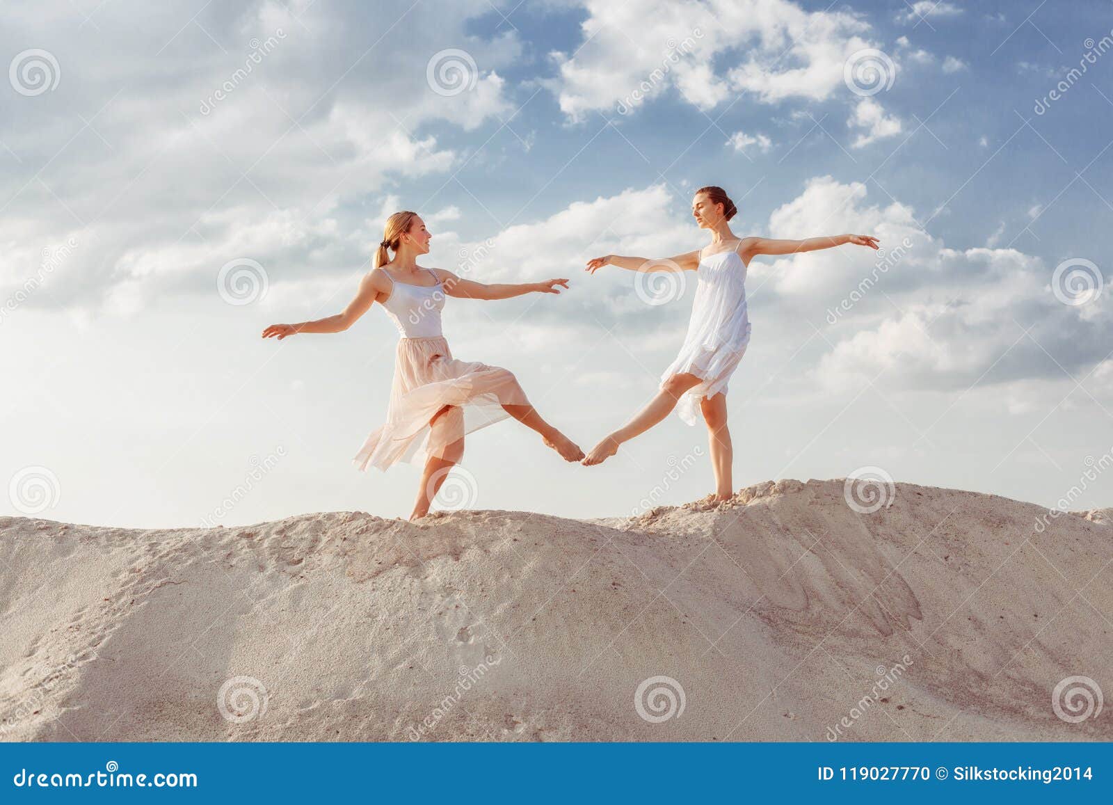 Two Dancers Dance in the Desert. Stock Photo - Image of motion, dress ...