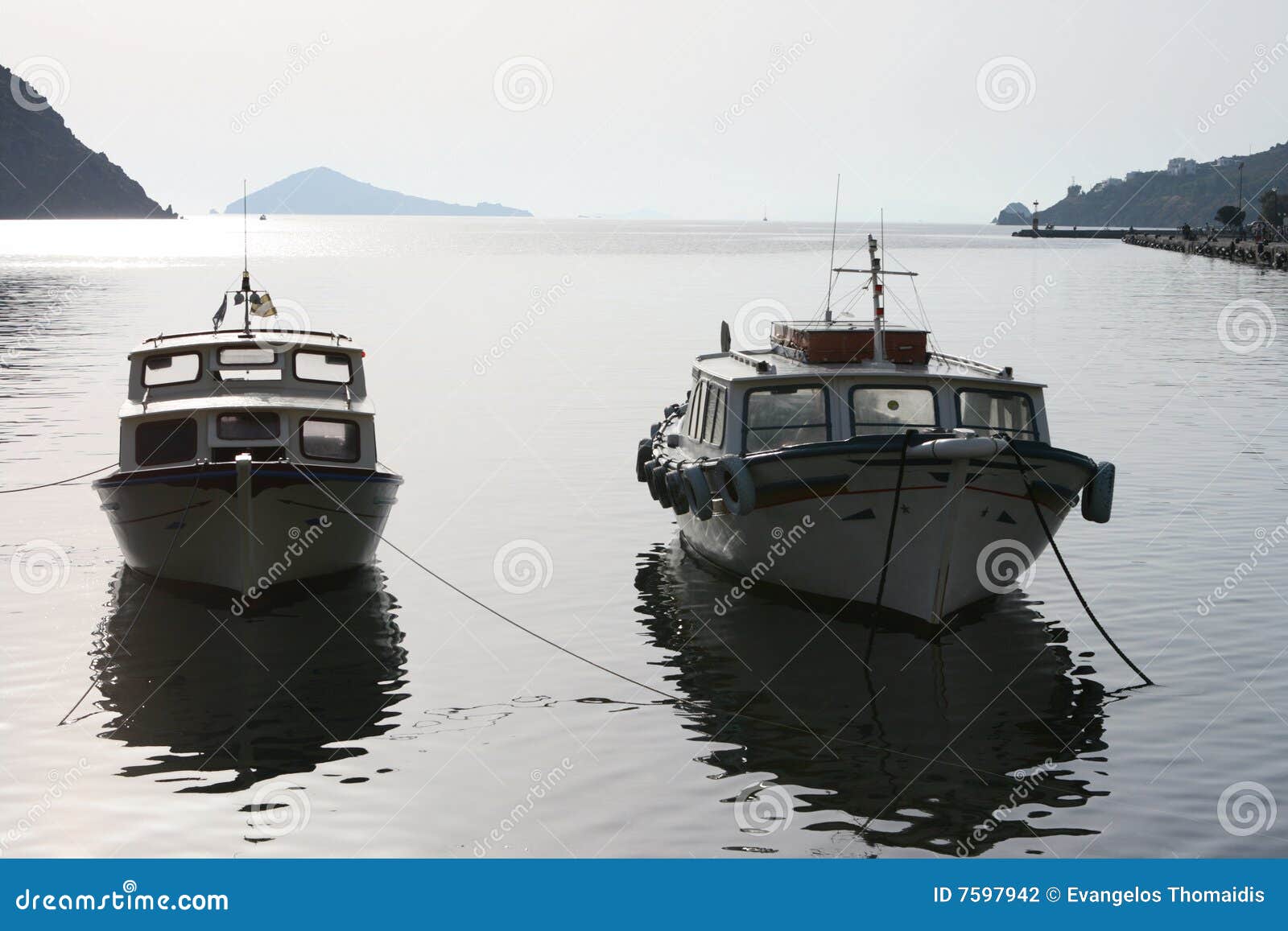 Two dark boats stock photo. Image of motorboat, island - 7597942