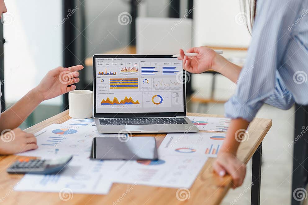 Two Data Analysts Working on Data Analysis Dashboard for Business ...