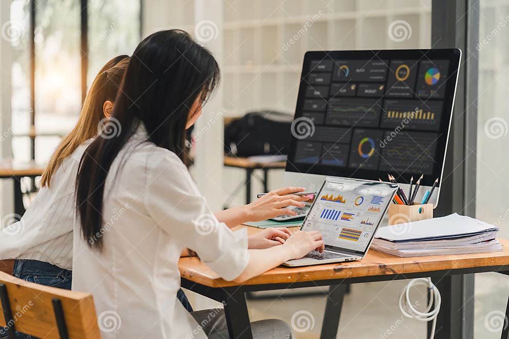 Two Data Analysts Working on Data Analysis Dashboard for Business ...