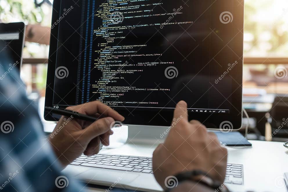 Two Data Scientists Work Together at Their Office Analyzing Big Data on Their Screen. Coders ...