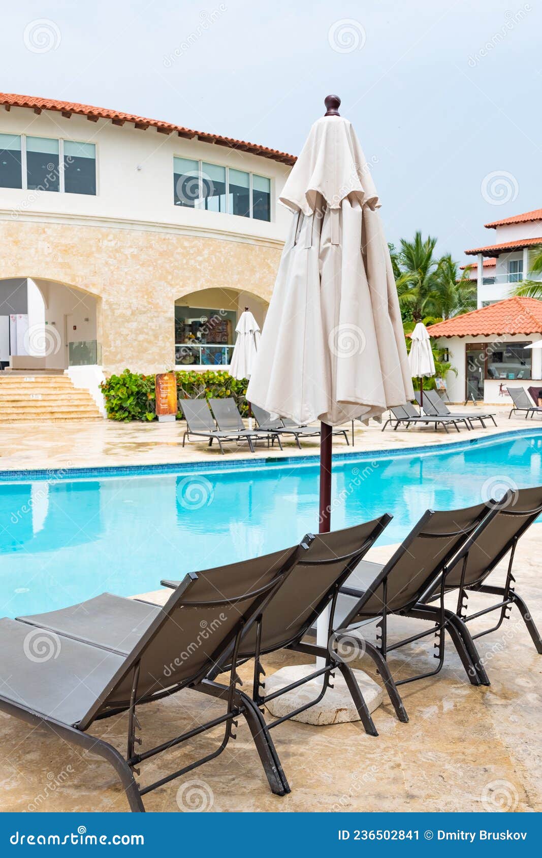 Chaise lounge by the pool stock image. Image of resort - 236502841