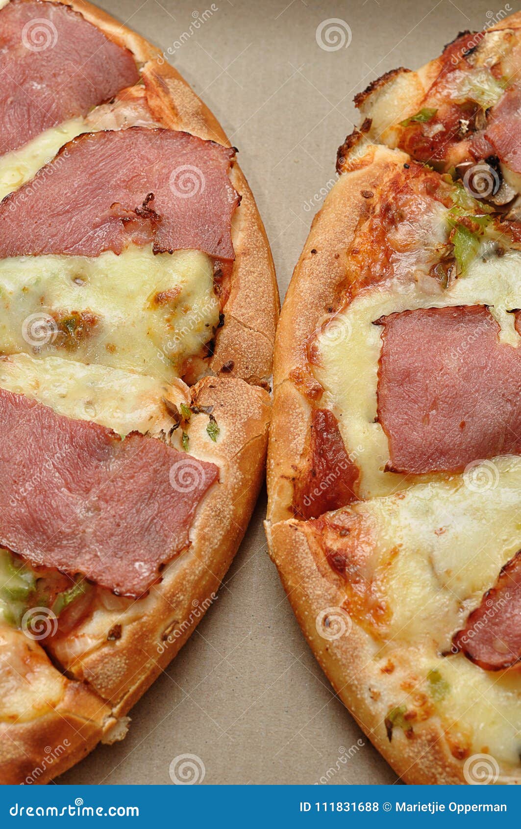 Two Pizzas with a Bacon and Cheese Topping Stock Photo - Image of ...