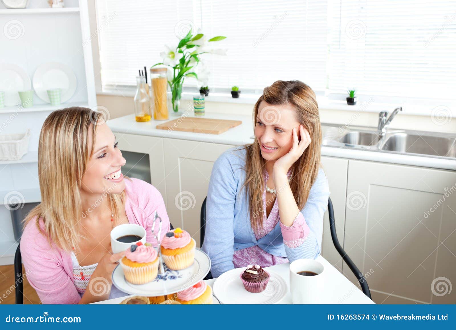 Two Delighted Female Friends Eating Pastries Stock Photo - Image of ...