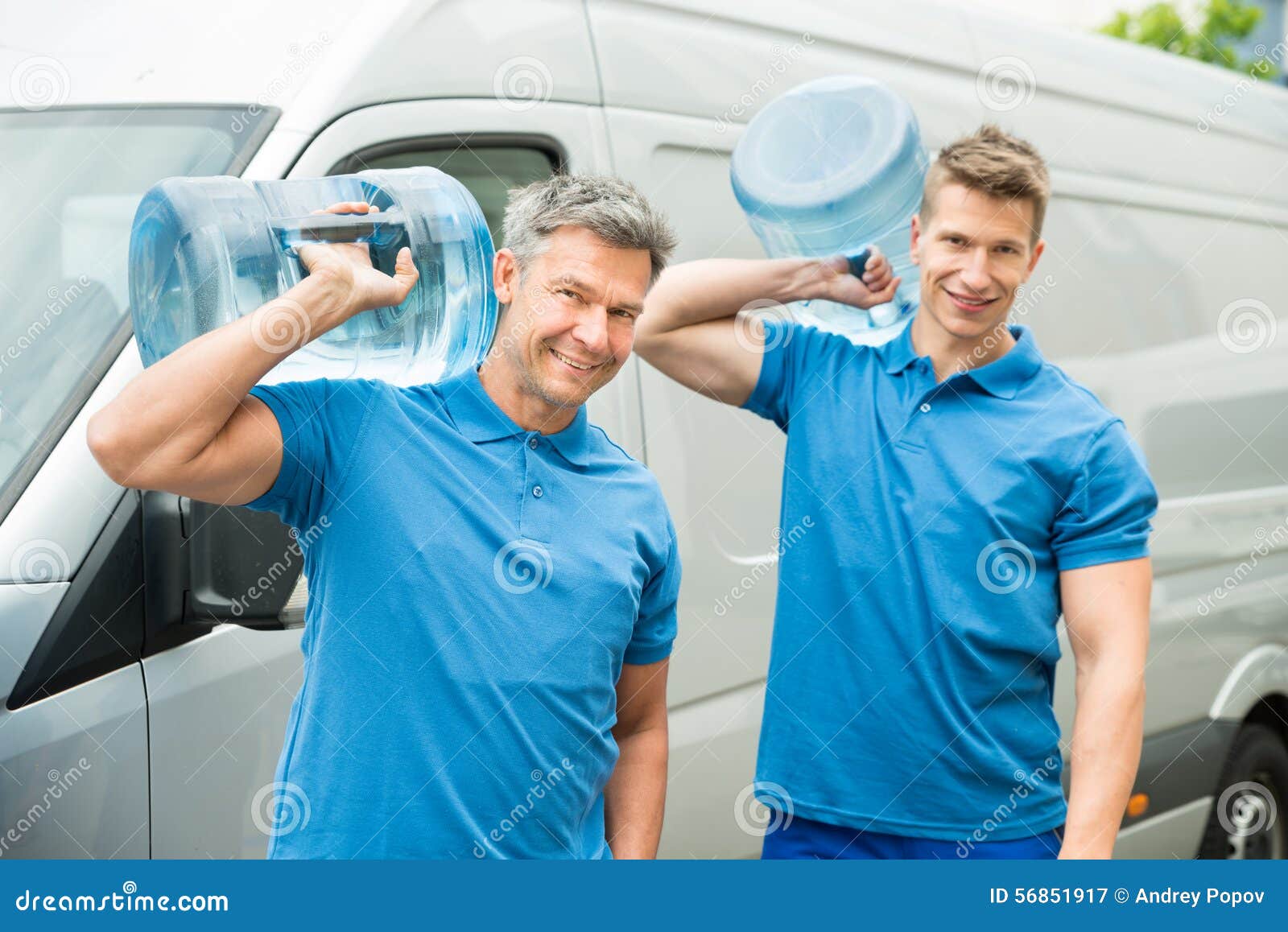 Two Delivery Men Delivering Bottles of Water Stock Image - Image of ...