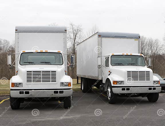 Two Delivery Trucks stock photo. Image of white, industry - 694332