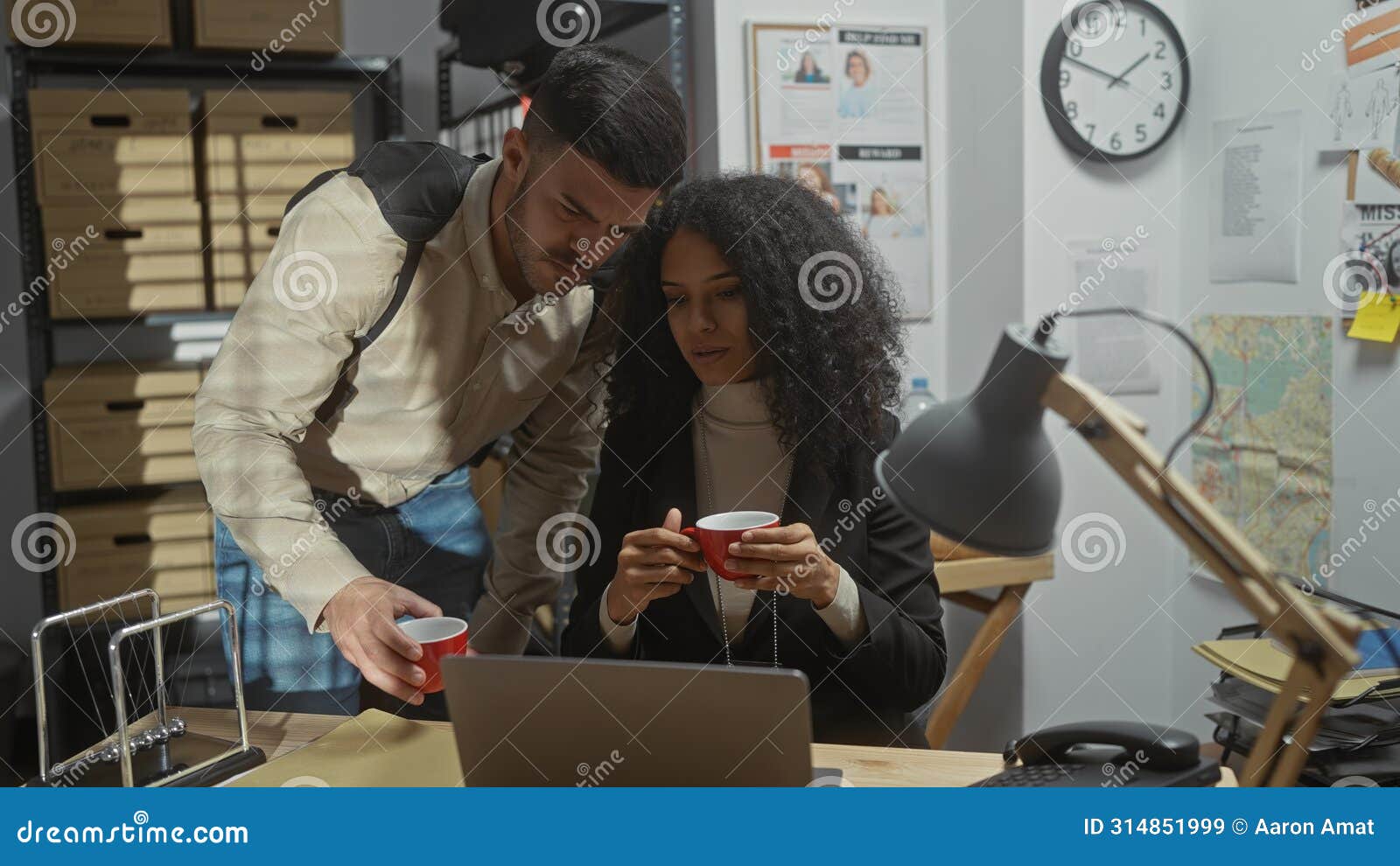 Two Detectives, a Man and Woman, Analyze Clues Over Coffee in an Office ...