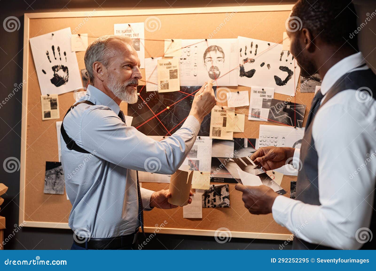 Two Detectives Pointing at Evidence Board Investigating Case Stock ...