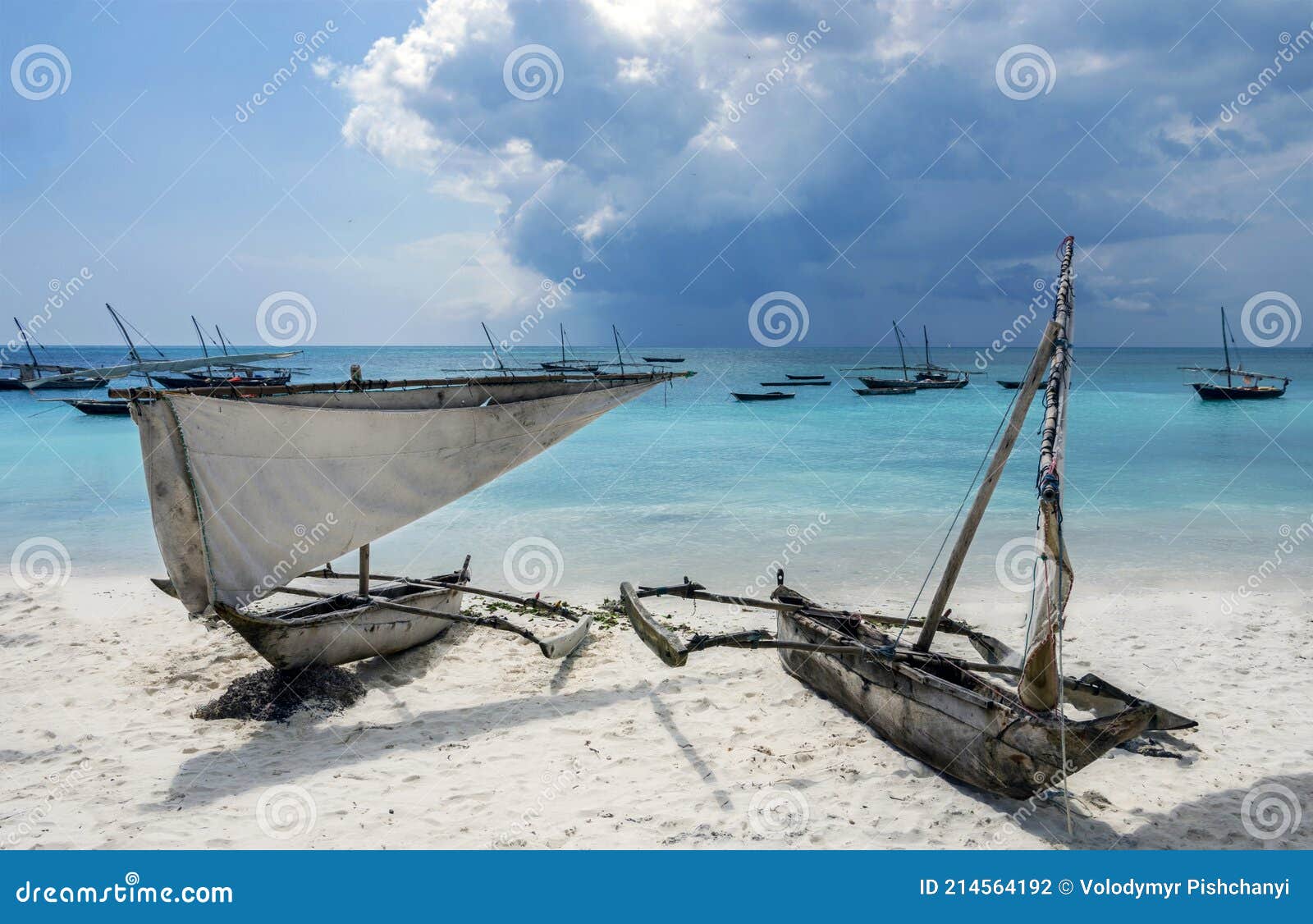 Two Dhow on the Shore Against the Backdrop of a Flotilla of Dhow in the ...