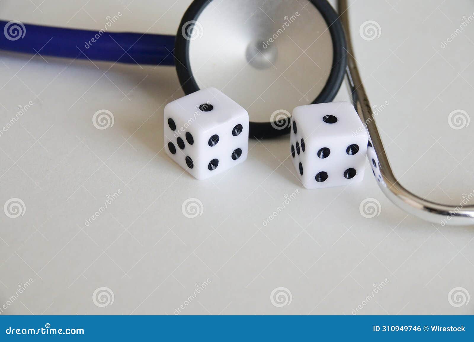 Two Dice Sitting Next To a Stethoscope on a Table Stock Photo - Image ...