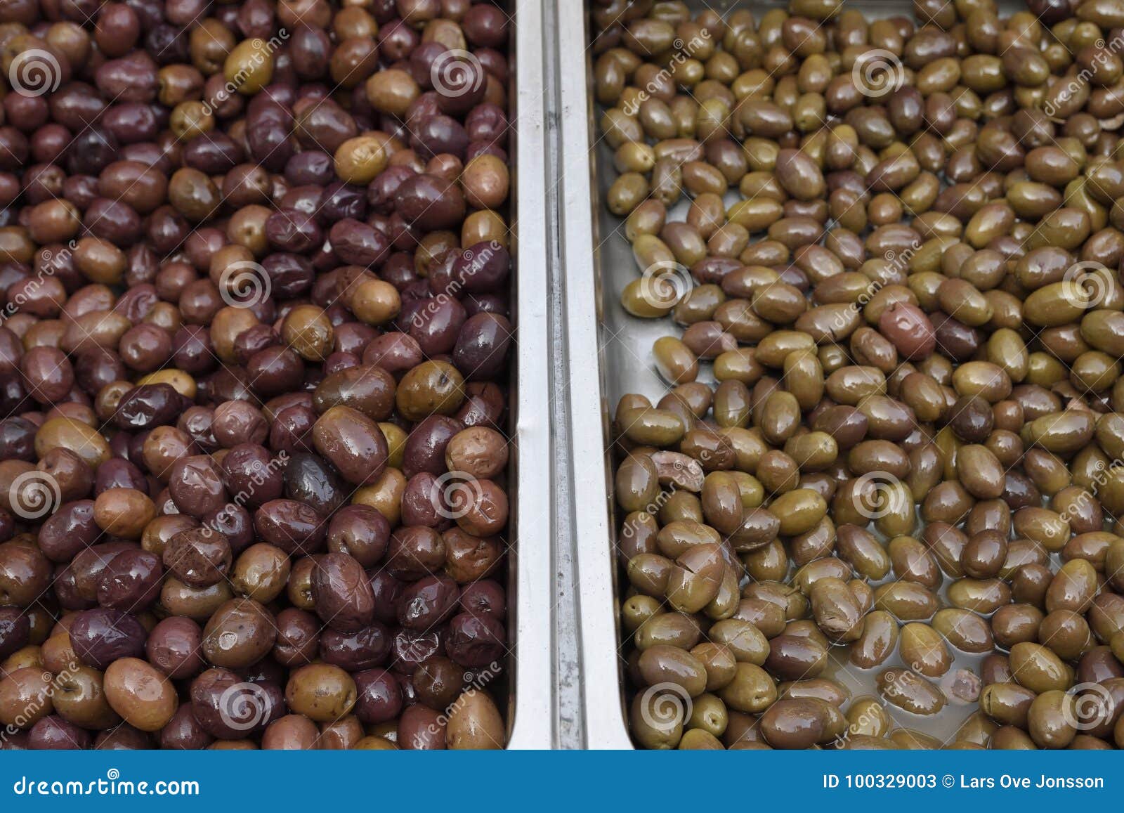 Two Different Assortment of Olives in Two Stainless Containers Stock ...
