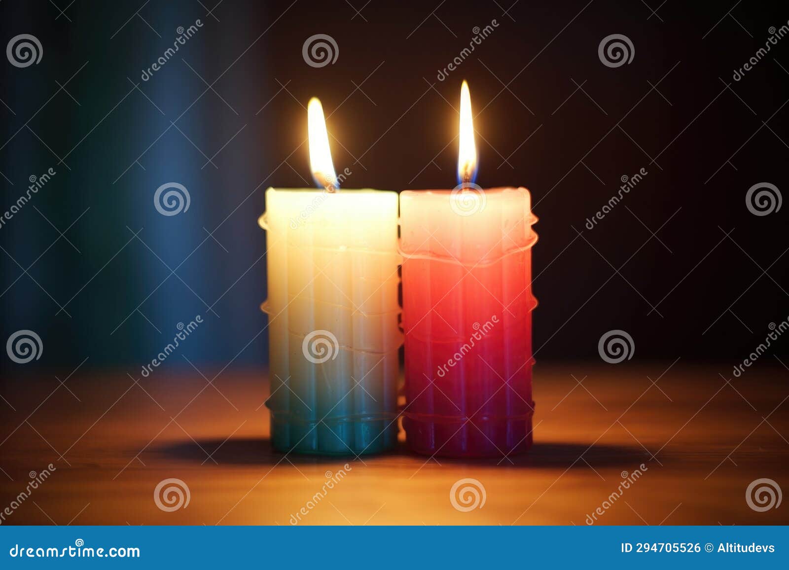 Two Different Colored Candles Burning Together Stock Photo - Image of ...