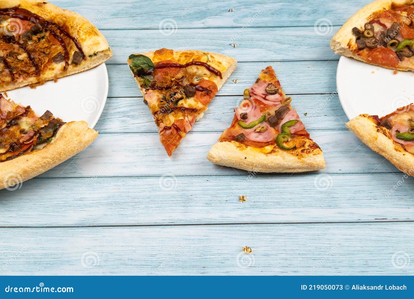 Two Different Delicious Big Pizzas on a Blue Wooden Background Stock ...