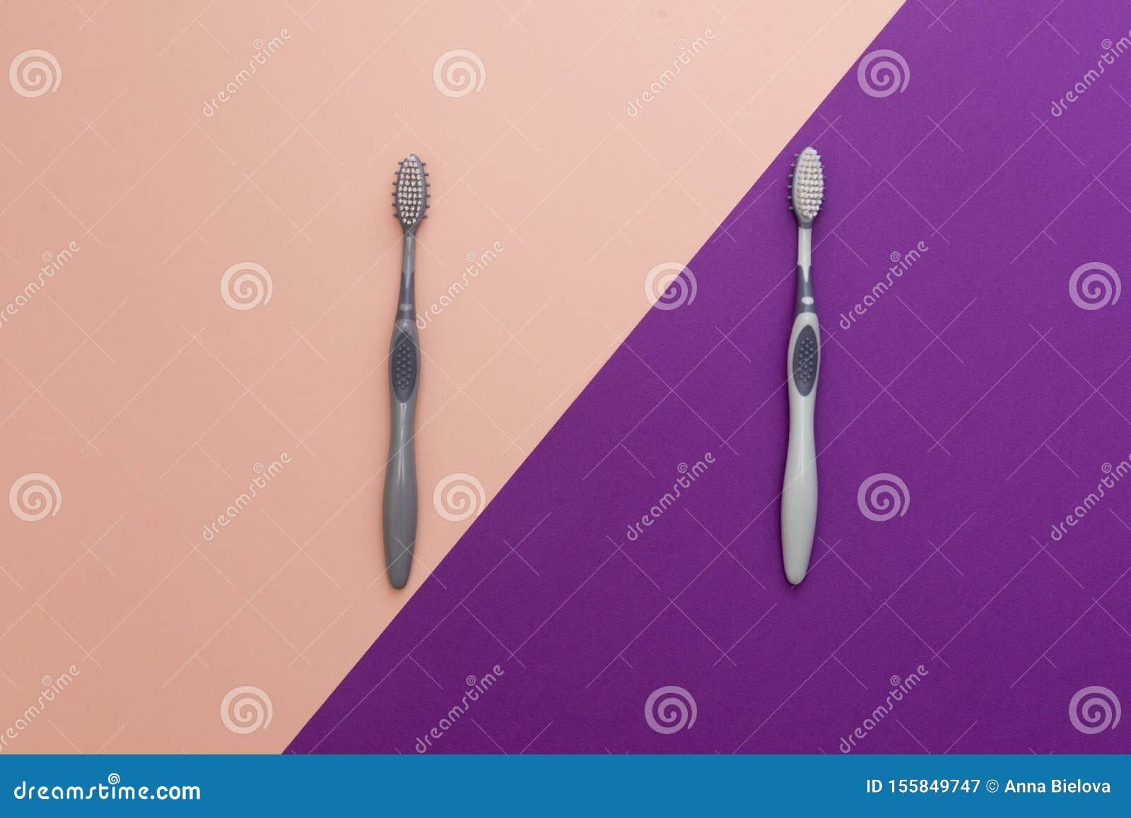 Two Different Grey Toothbrushes on a Pink Background. Stock Image ...