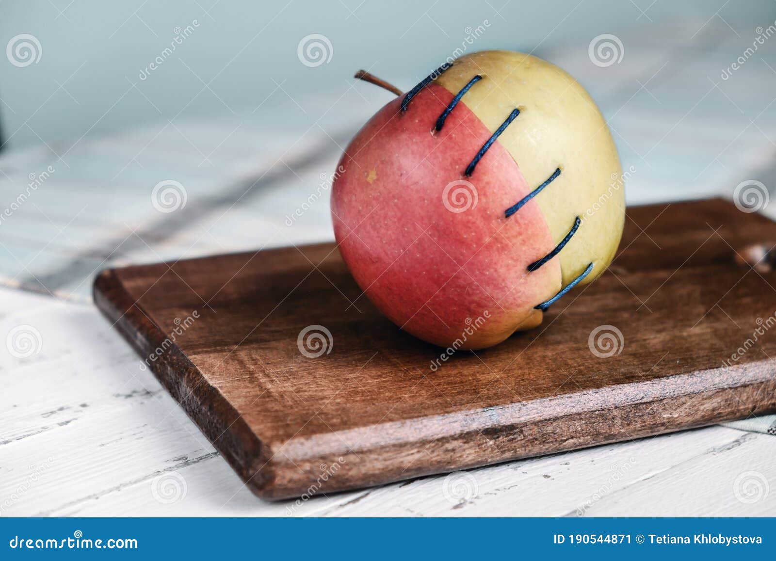 Two Different Halves of Apple Connected by Thread Stock Image - Image ...