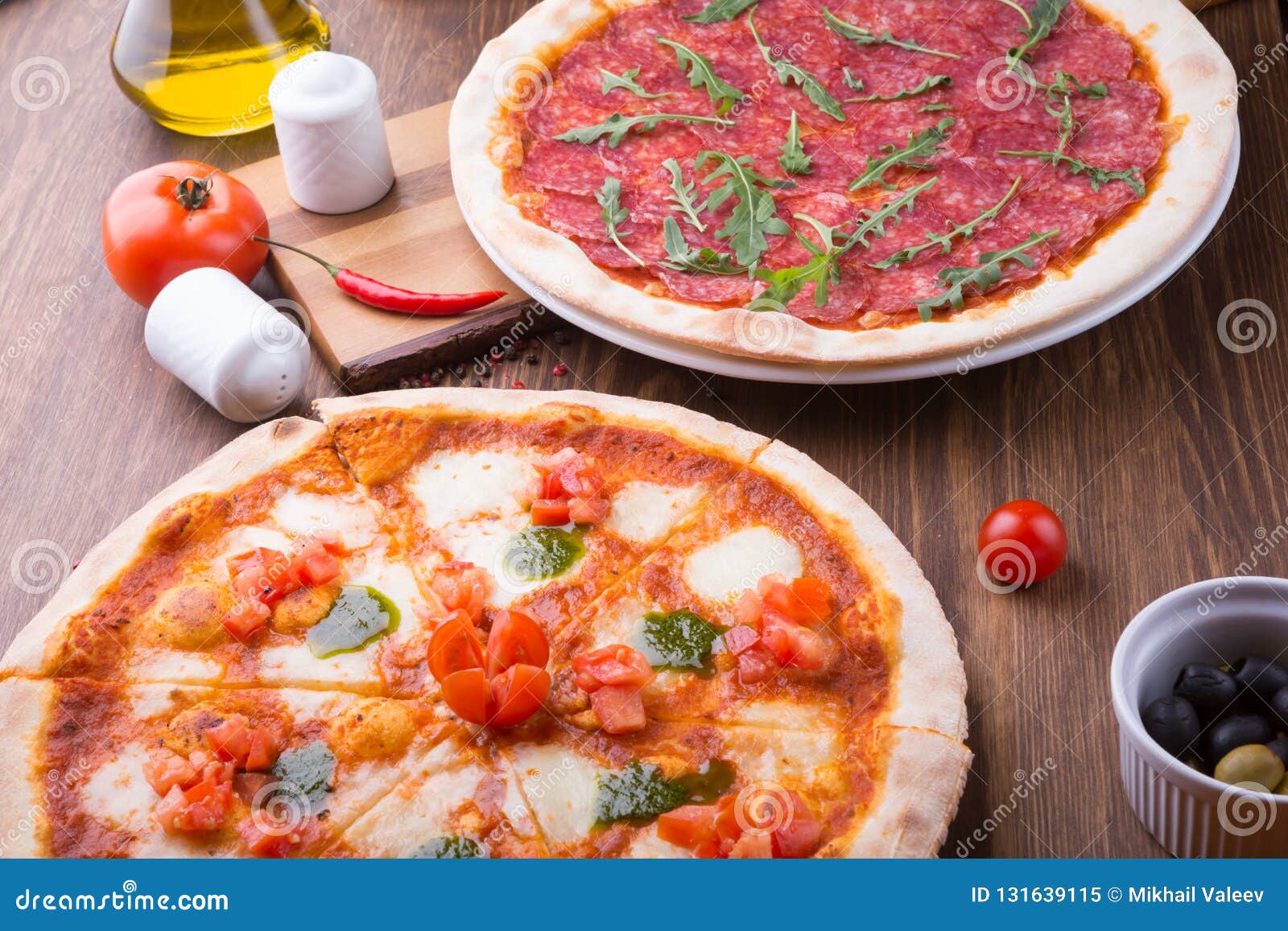 Two Different Pizzas Freshly Baked and Served on Wooden Table Stock ...