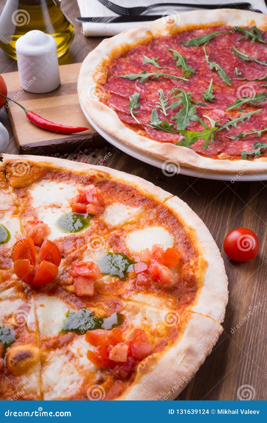 Two Different Pizzas Freshly Baked and Served on Wooden Table Stock ...