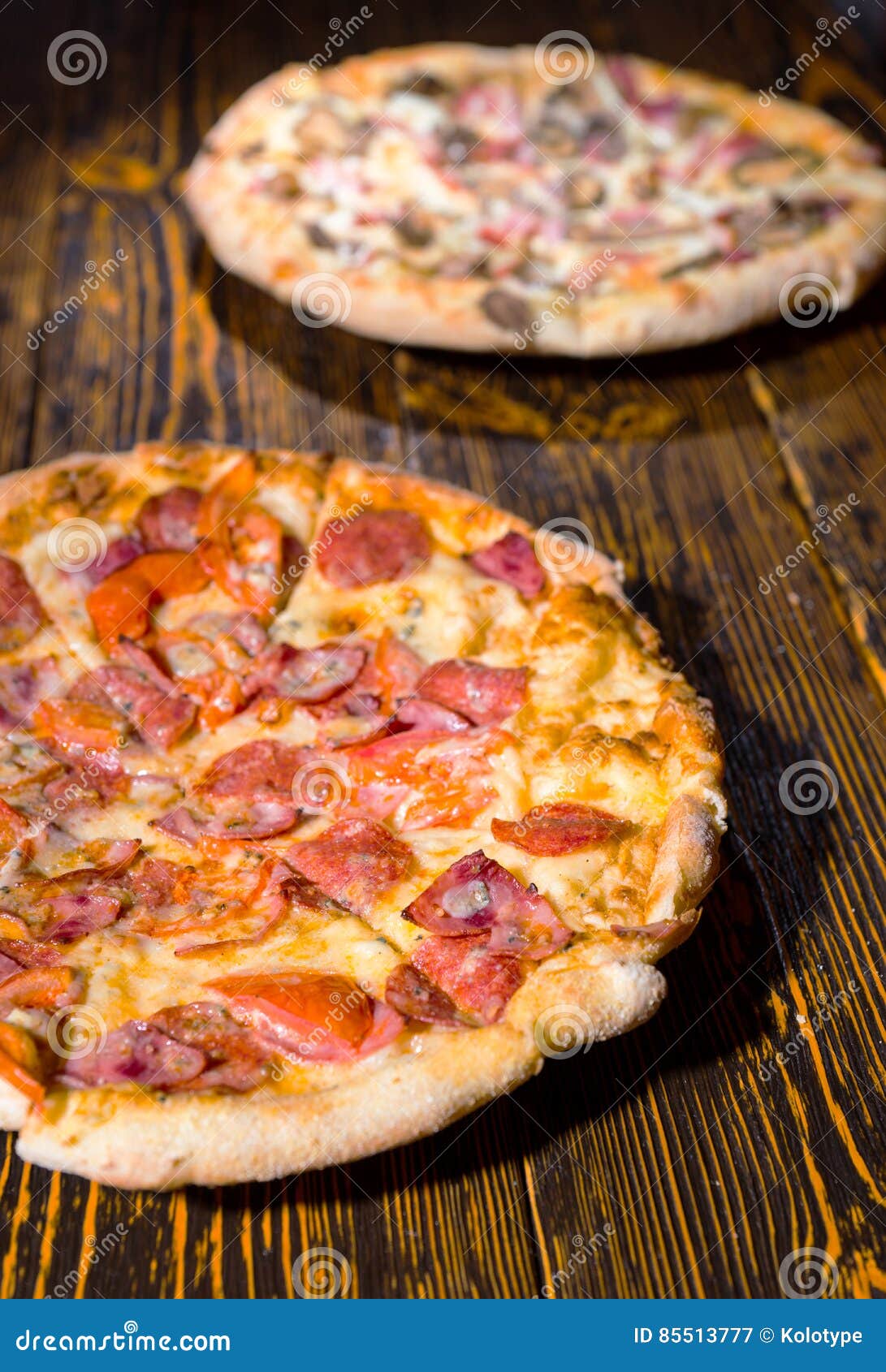 Two Different Pizzas with Variety of Toppings and Cheese Stock Image ...