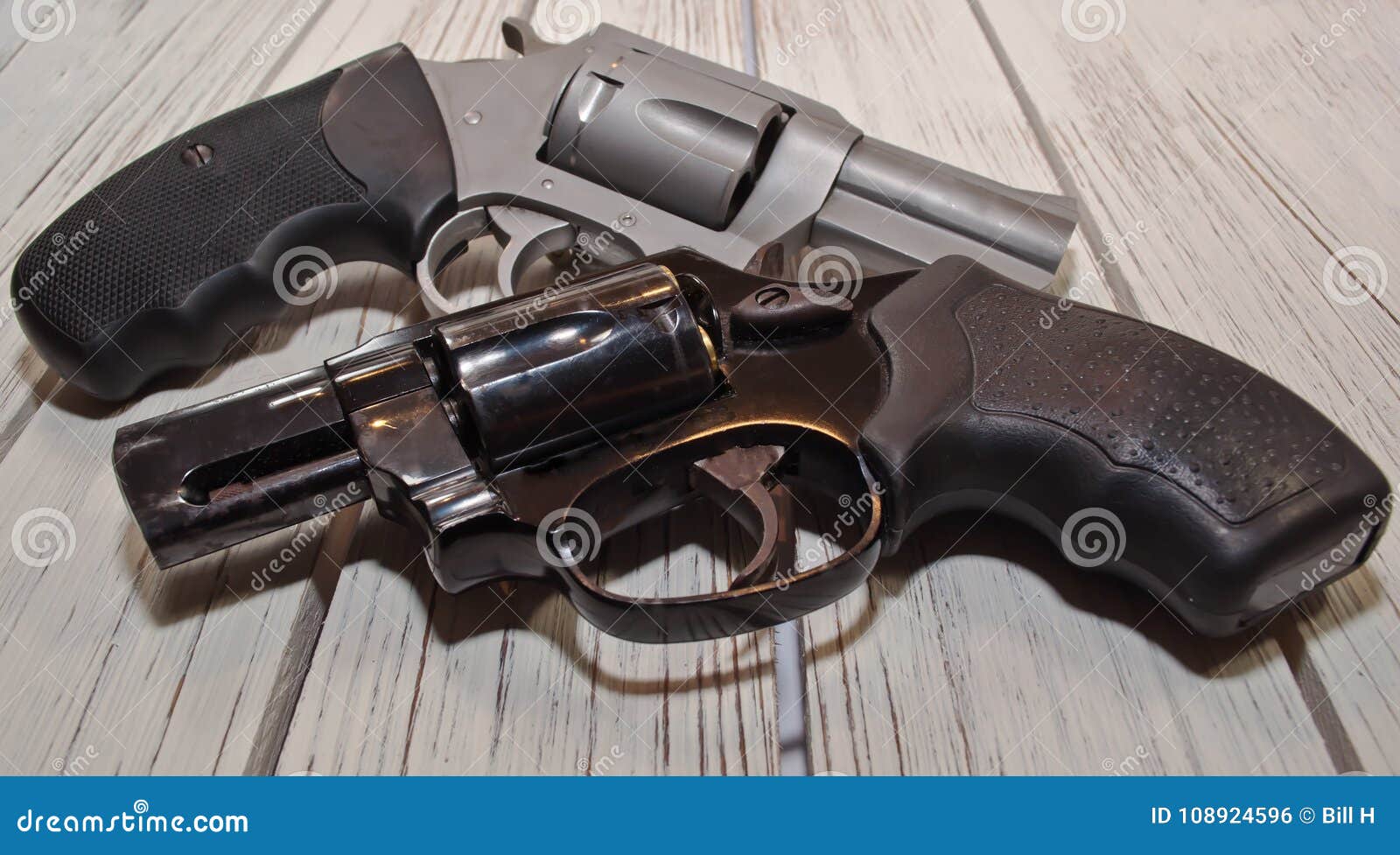 Two Different Revolvers on a Wooden Table Stock Photo - Image of ...