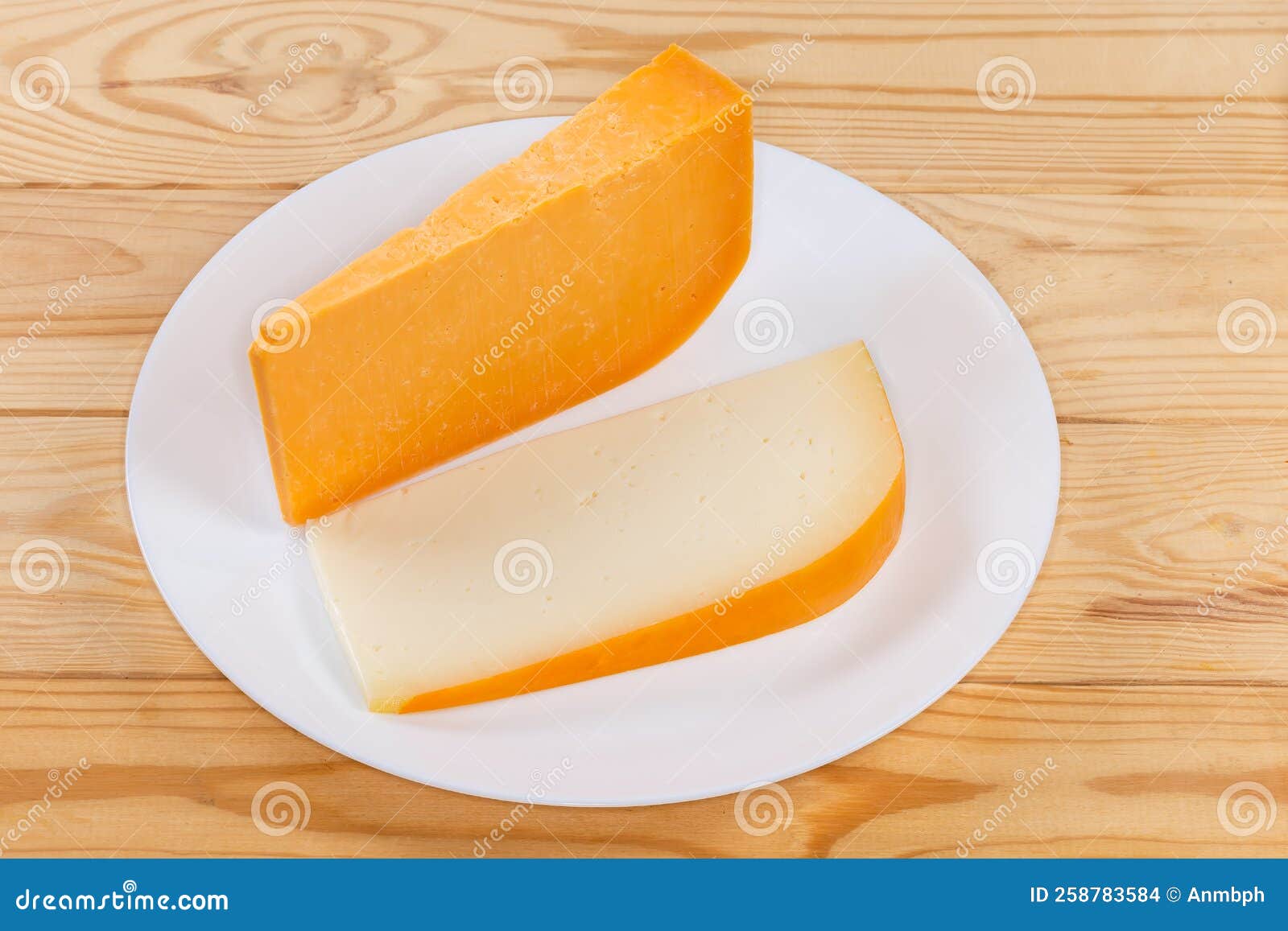 Two Different Semi-hard Cheese on Dish on Rustic Table Stock Photo ...