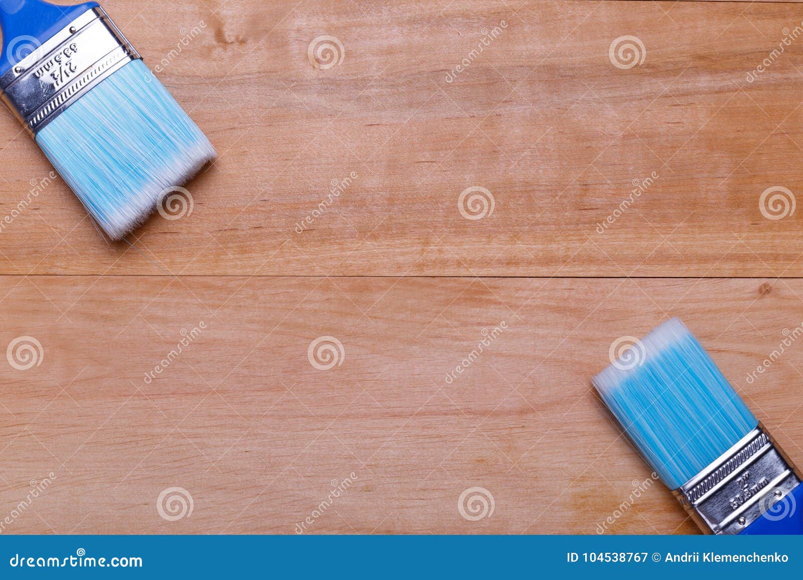 Two Brushes in Different Angles Point at Each Other Against a Wooden ...