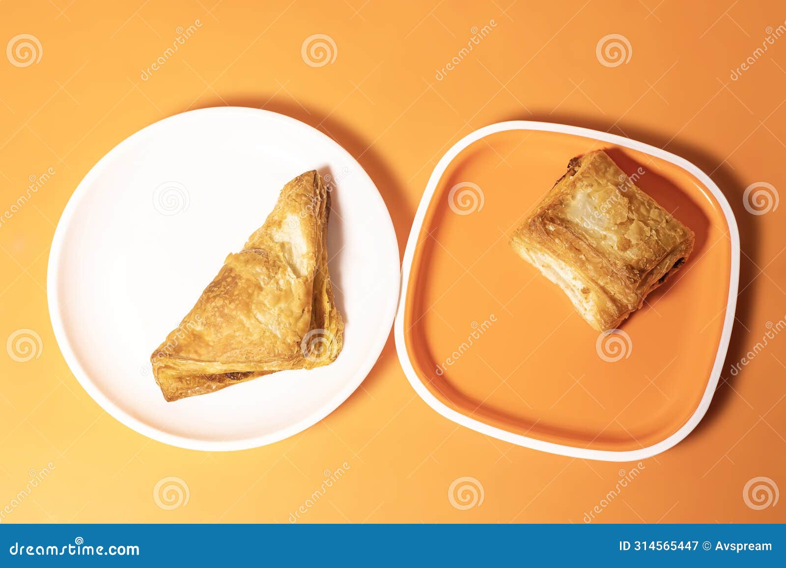 Two Different Types of Crunchy Veg Puff Pieces on a Plate on an Orange ...