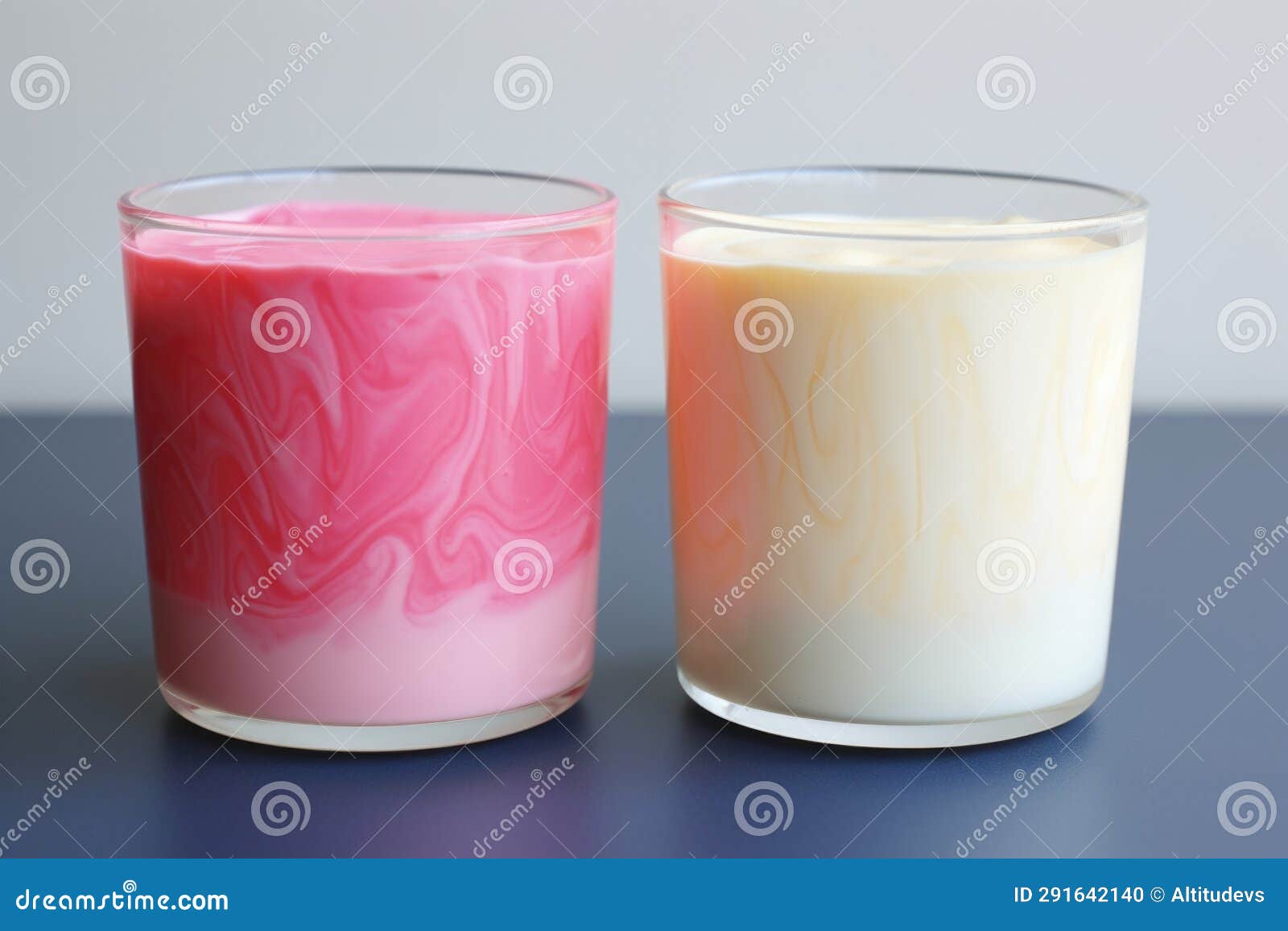 Two Differently Colored Cups of Yogurt Side by Side Stock Photo - Image ...