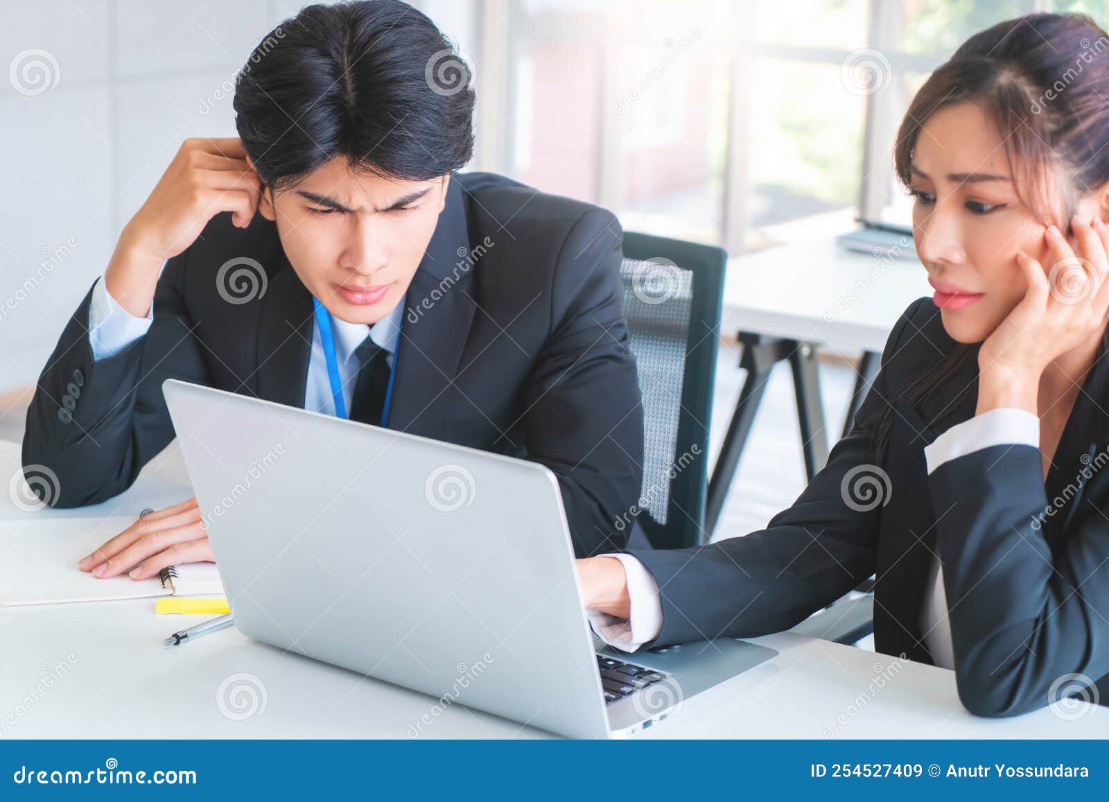 Two Disappointed Business Person Looking at Computer Screen with Upset ...