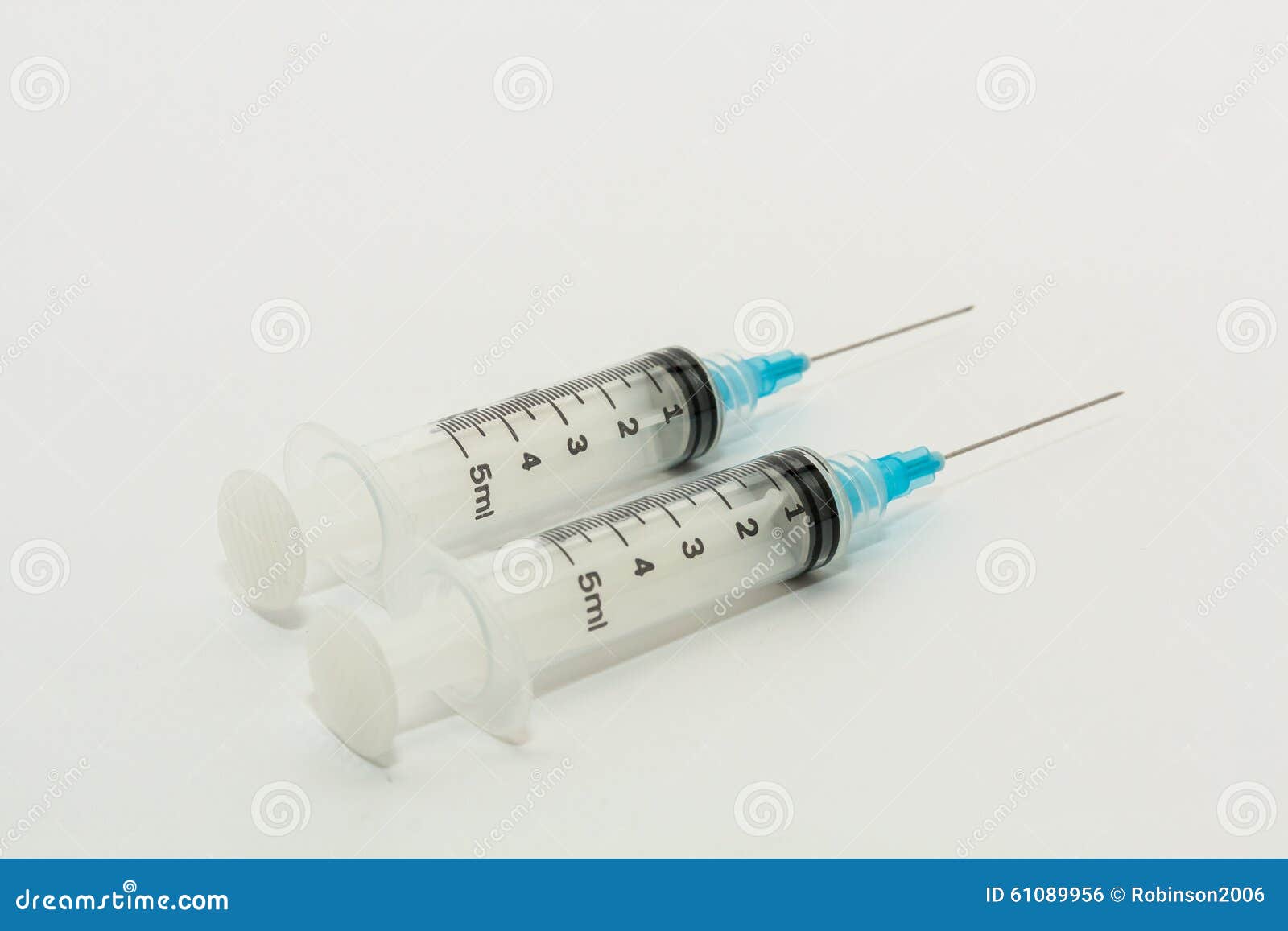 Two Disposable 5ml Syringes with Blue Needles Stock Photo - Image of ...