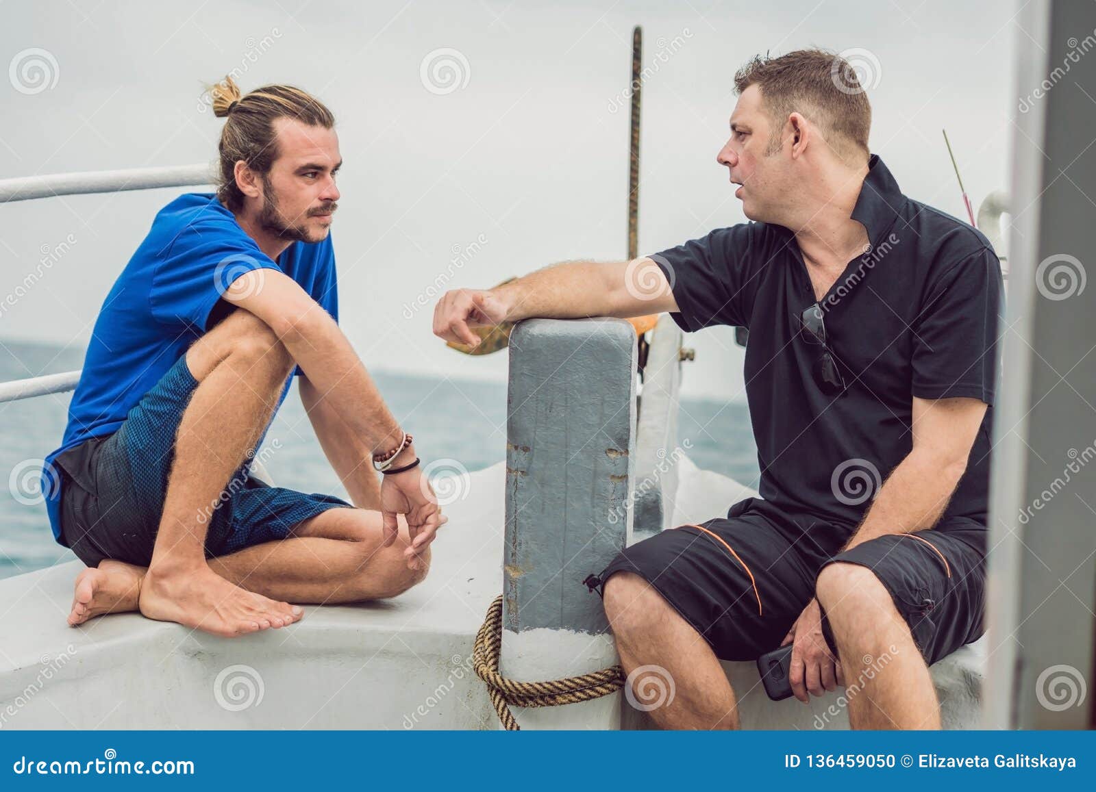 Two Divers Discuss the Dive on the Bow of the Ship Stock Photo - Image ...